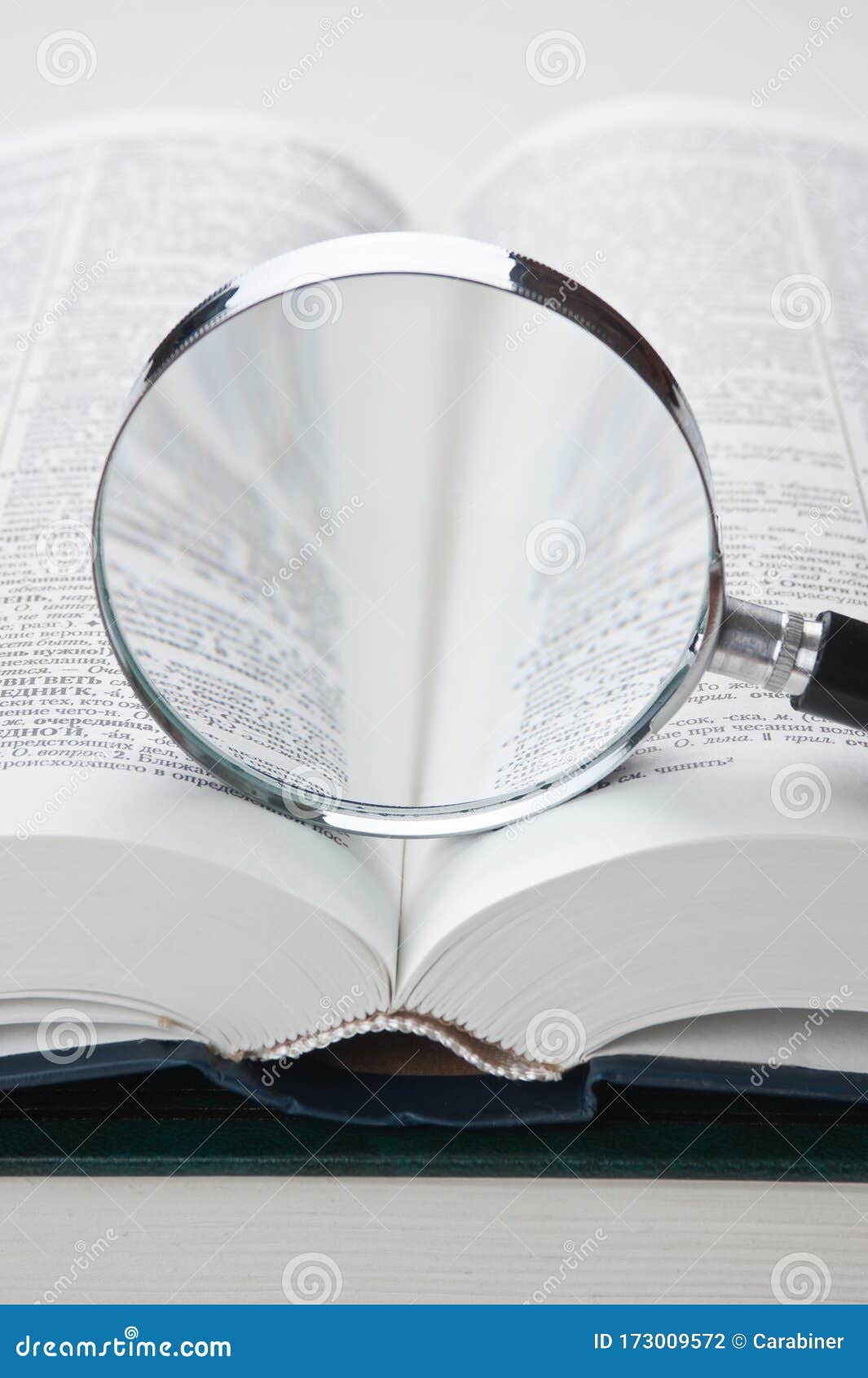 Books and magnifying glass stock photo. Image of library - 173009572