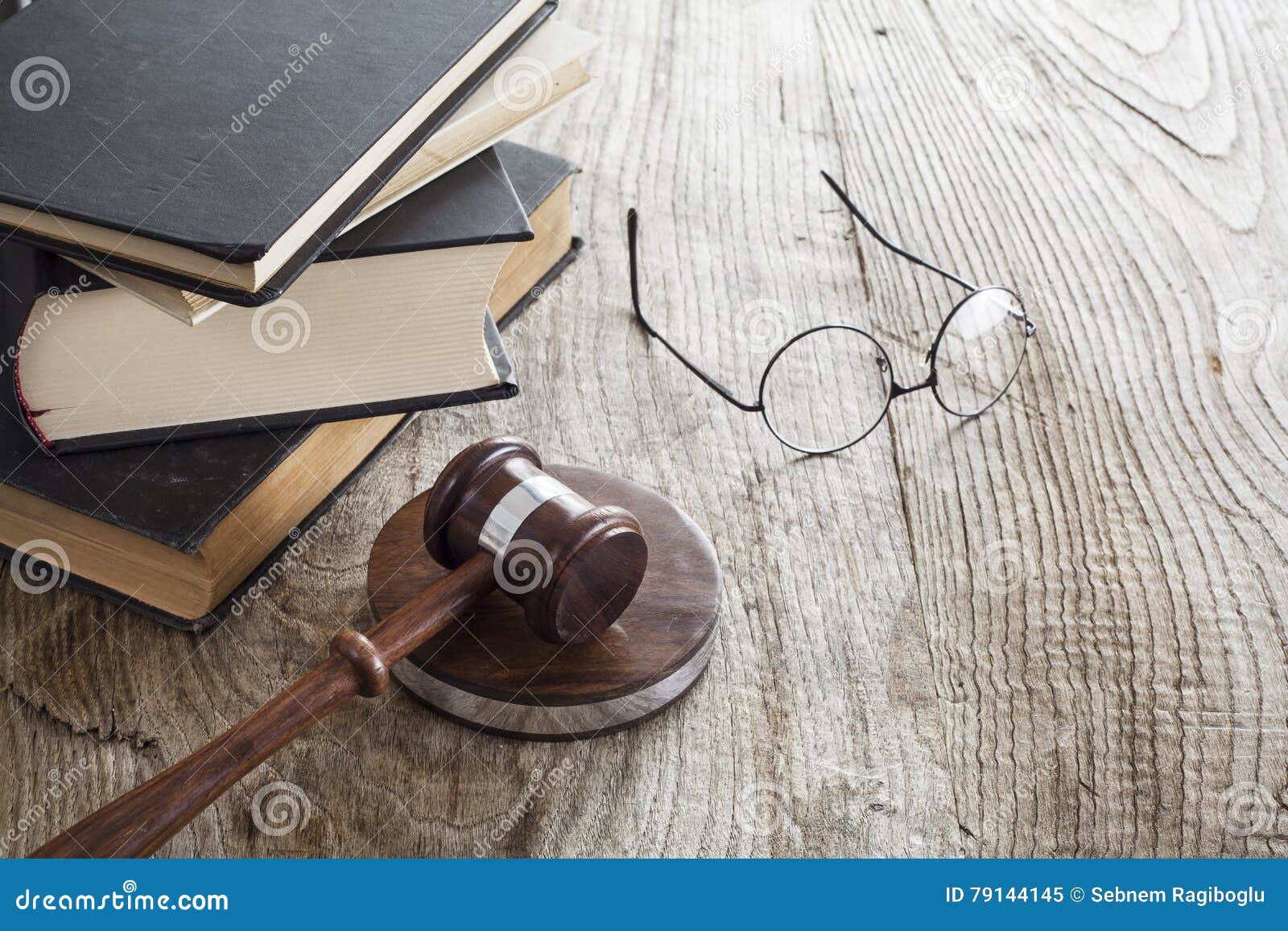 Books with mallet on table stock image. Image of trial - 79144145