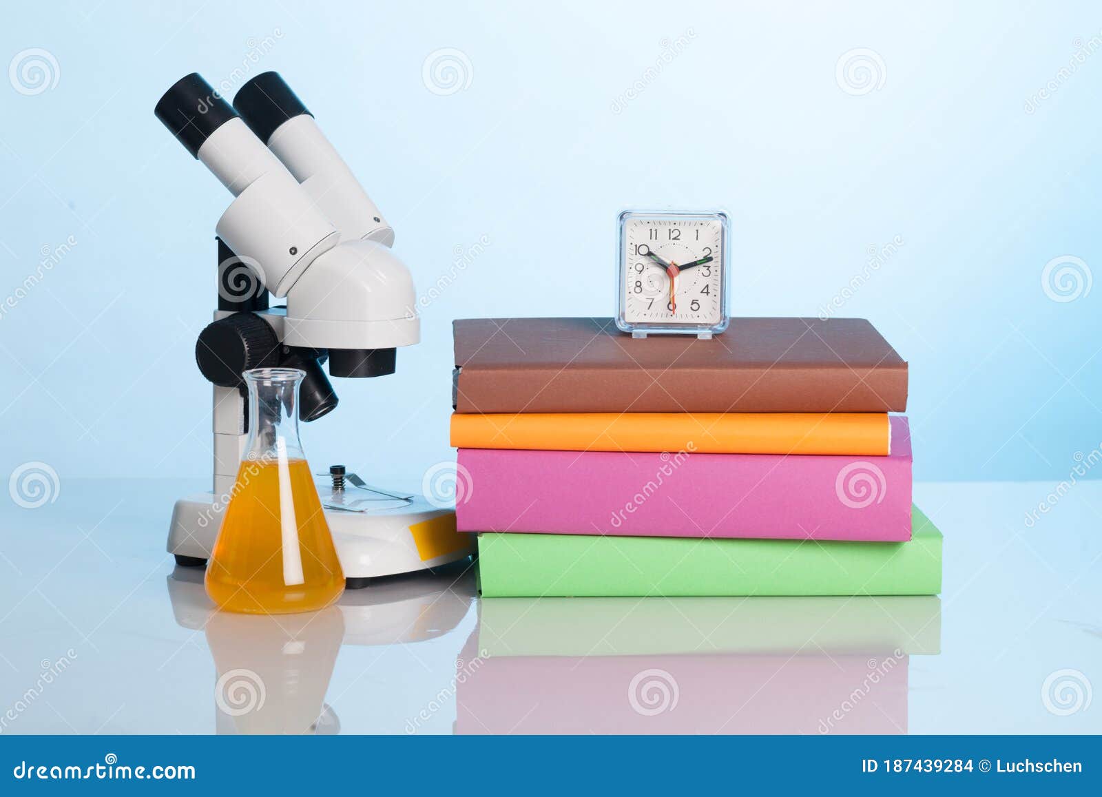 Books and a Microscope on the Desk of the Student Stock Photo - Image ...