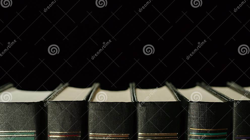 Books in a Row on Black Background Stock Photo - Image of shot, read ...