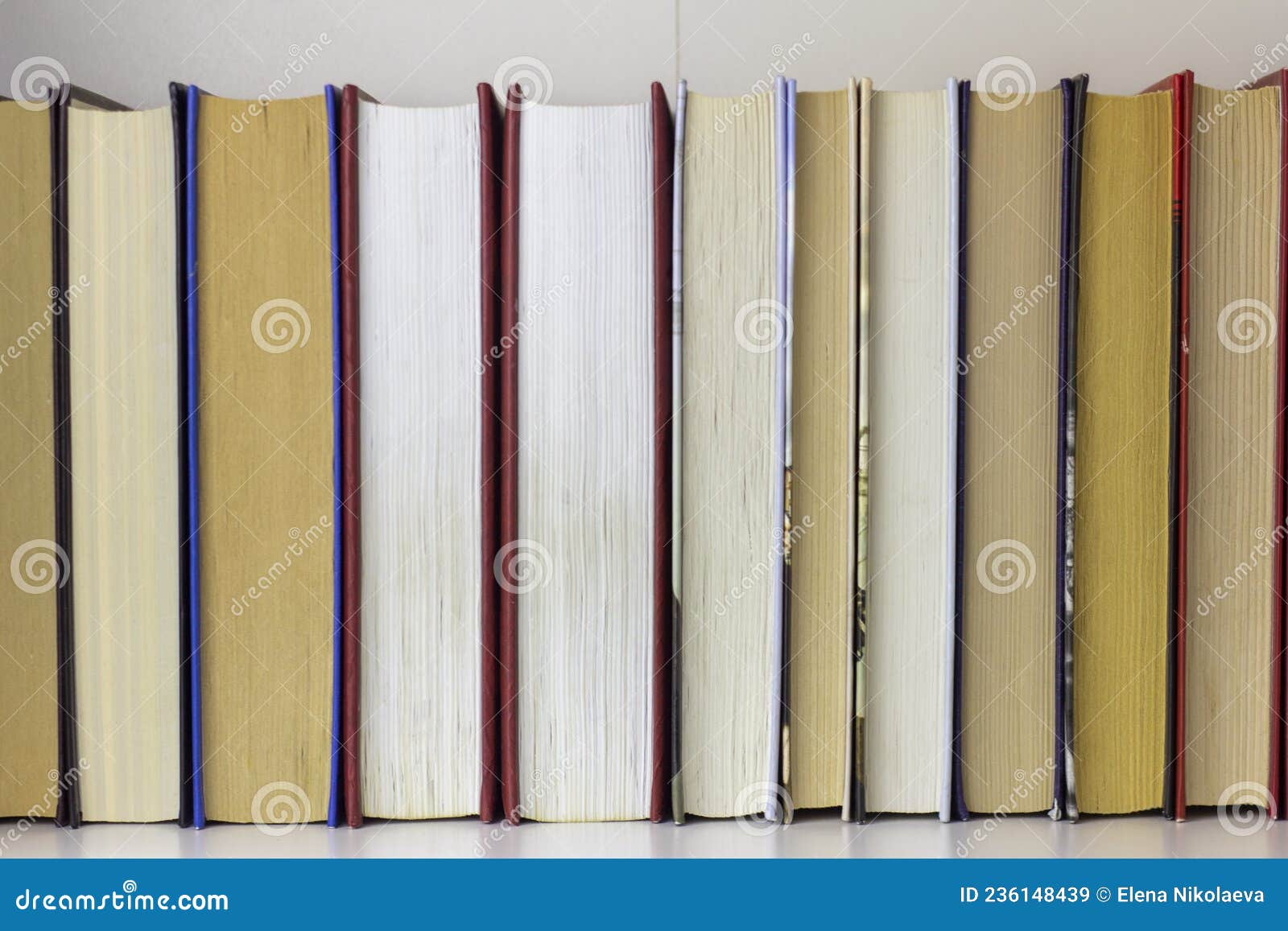 Books.Several Books are in a Row on a Shelf or in a Closet. Stock Image ...