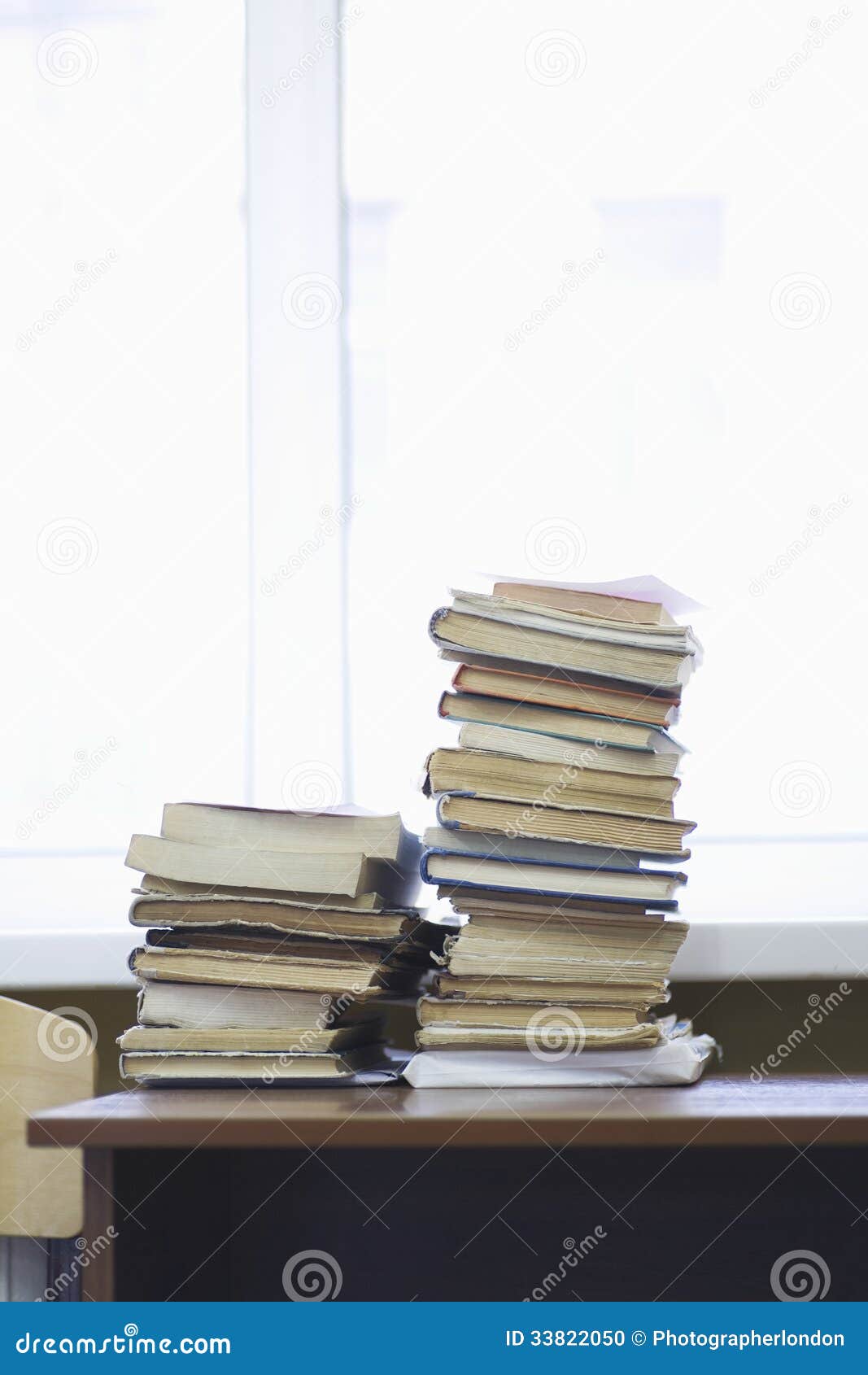 Books Stacked on Desk in Library Stock Photo - Image of literature ...