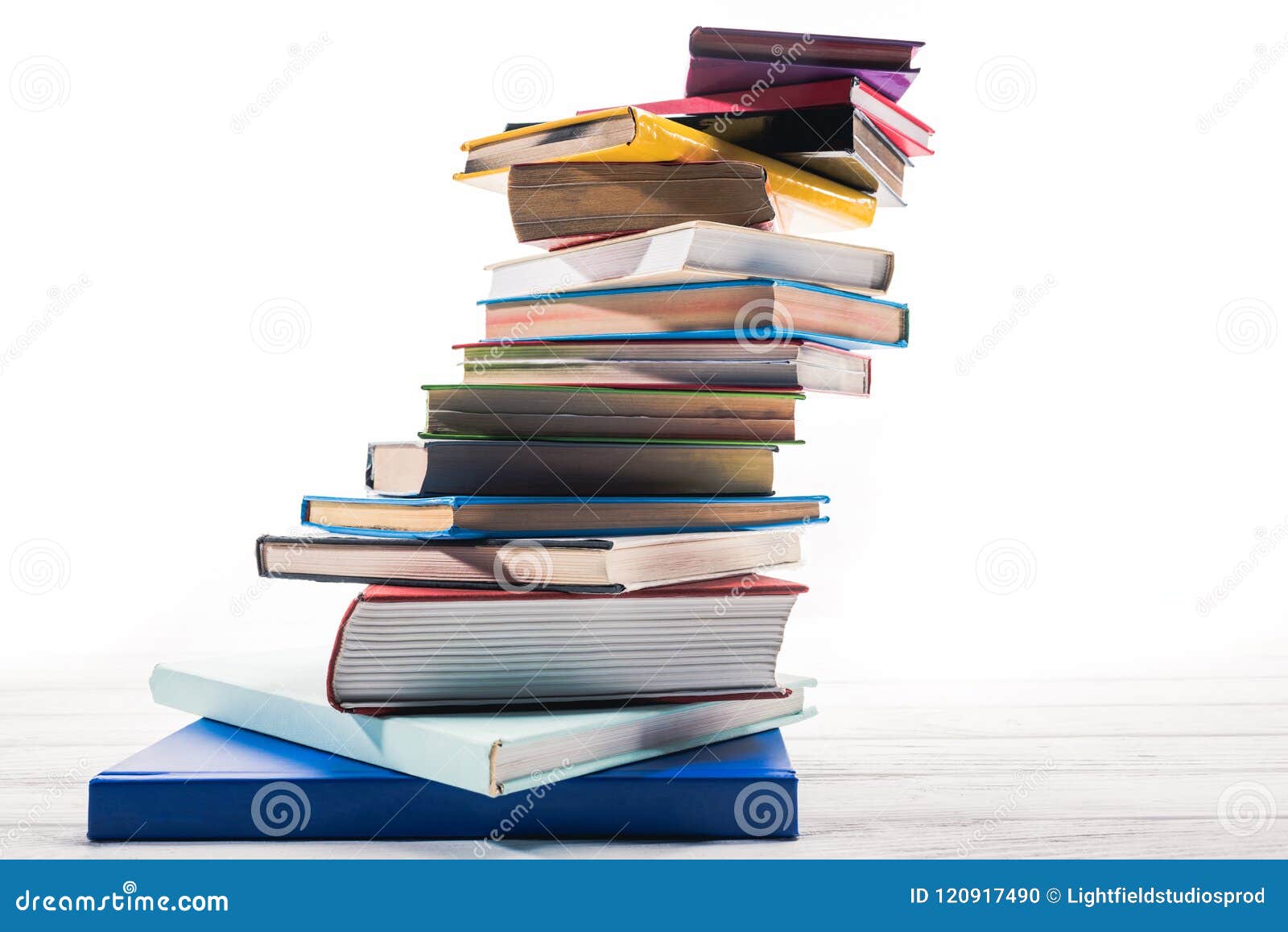 Books stacked in mess stock photo. Image of colorful - 120917490