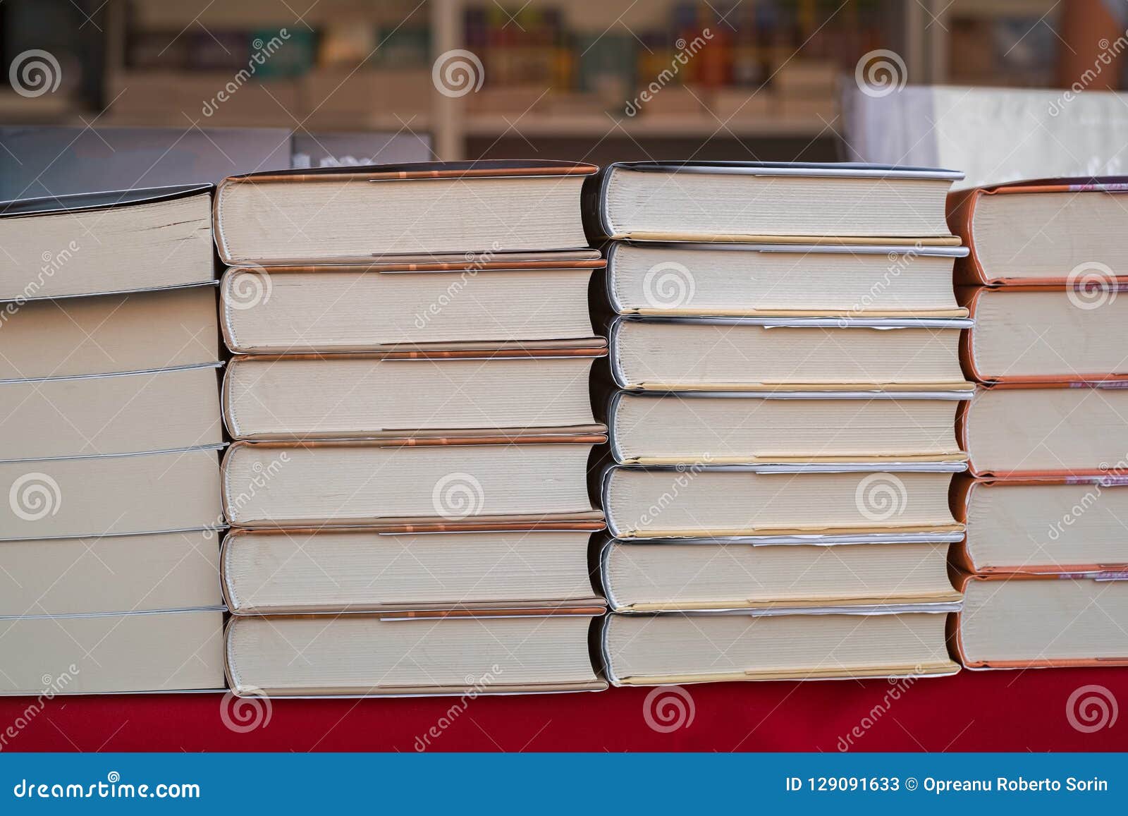 Books stacked on table stock image. Image of college - 129091633