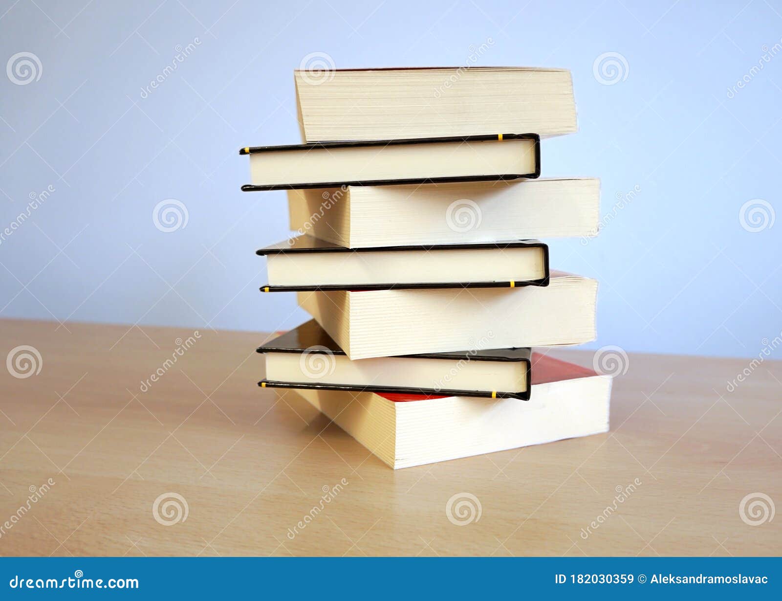 Books Stacked Vertically on the Blank Background Stock Image - Image of ...