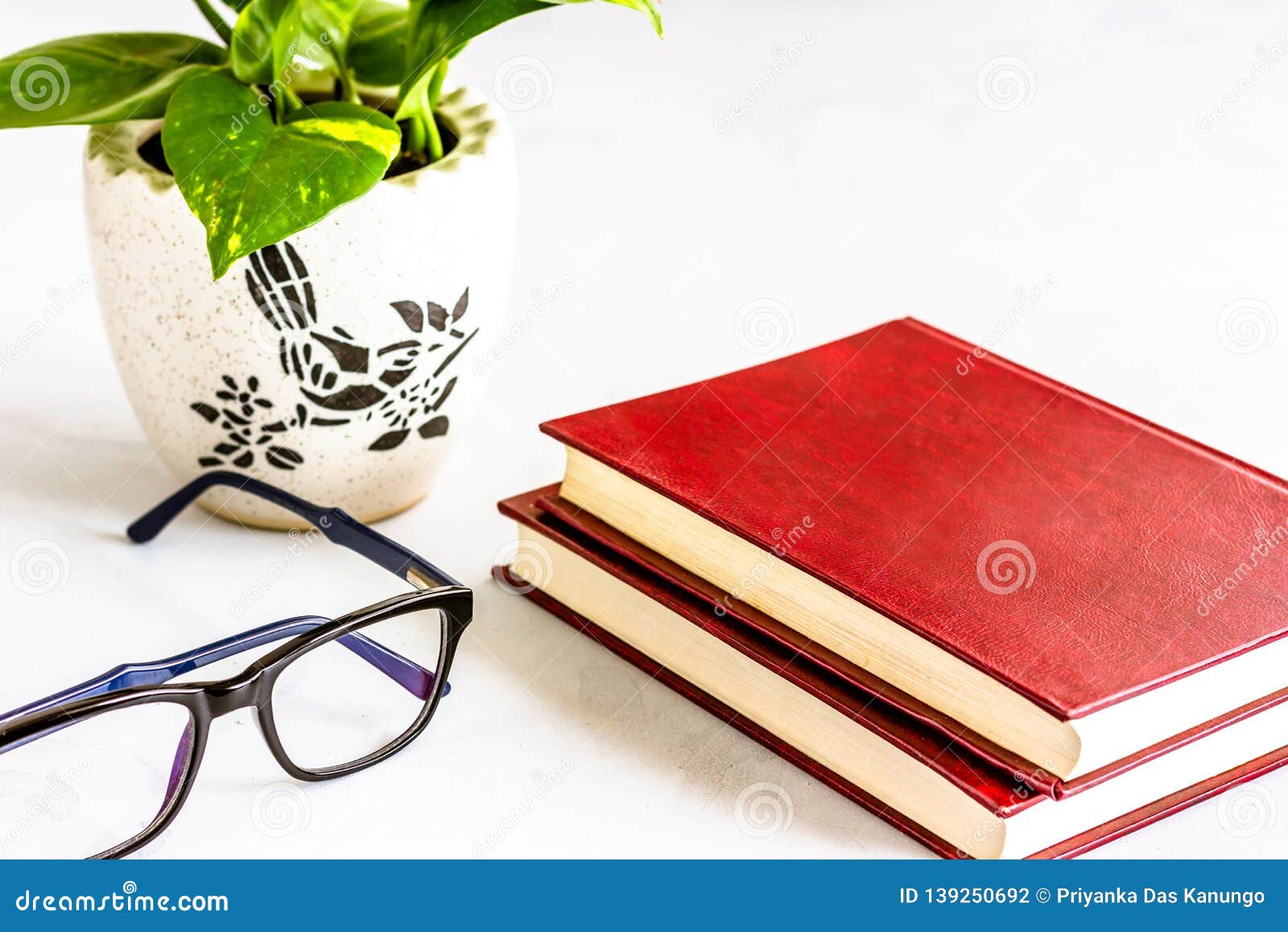 Books on the Table Top with Spectacles and Plant Stock Photo - Image of ...
