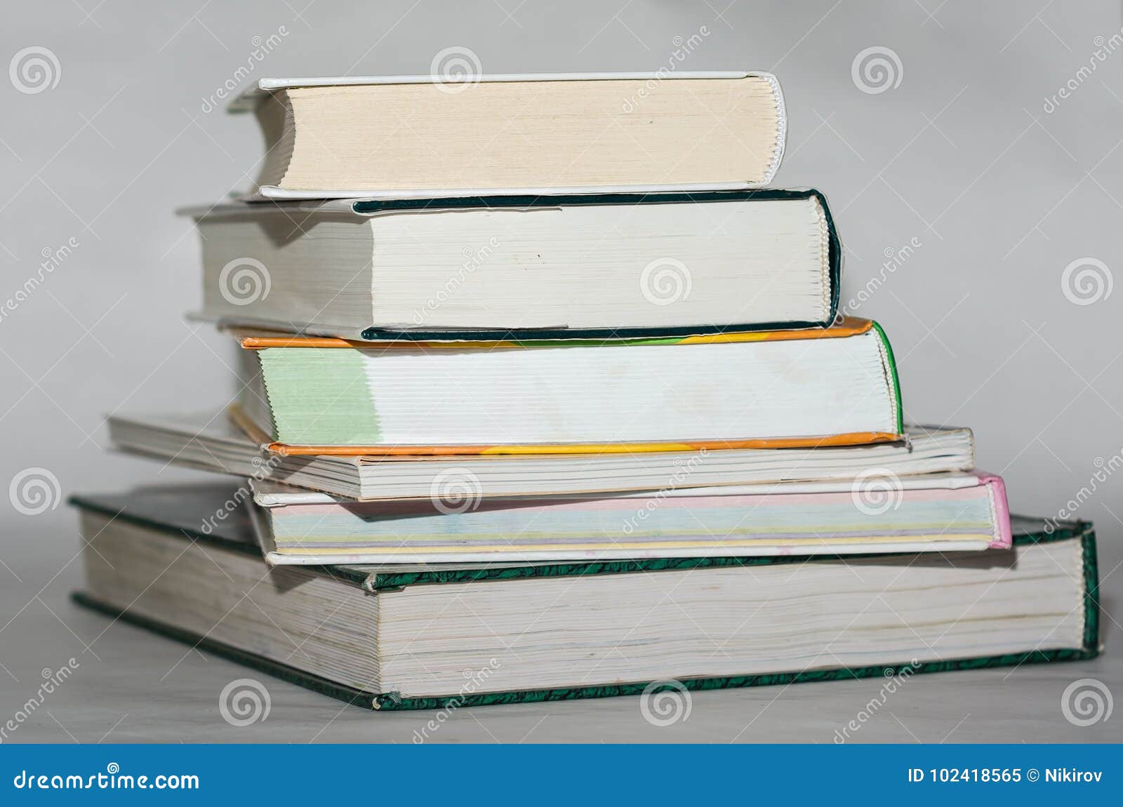 Books Textbooks Stacked On A Shelf, A Bookshelf With Book Spines ...