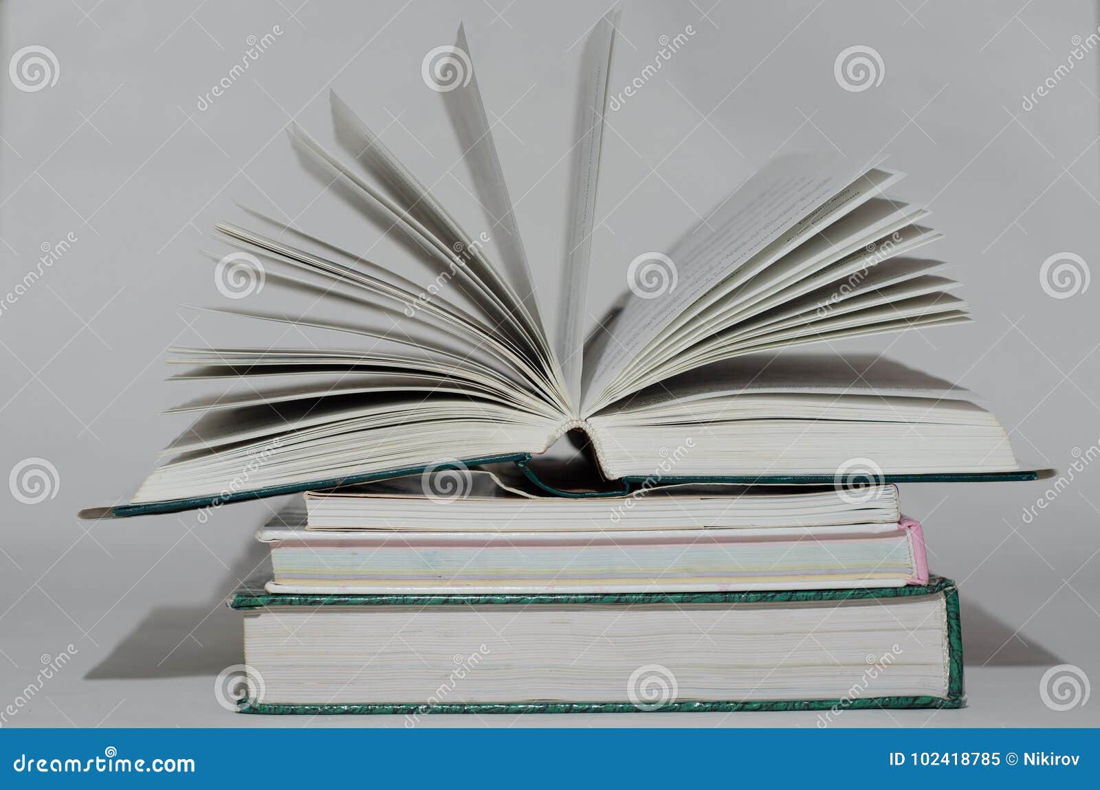 Books Textbooks Stacked On A Shelf, A Bookshelf With Book Spines ...