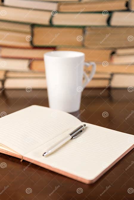 Books on Wooden Table with Tea and Open Notebook Stock Photo - Image of ...
