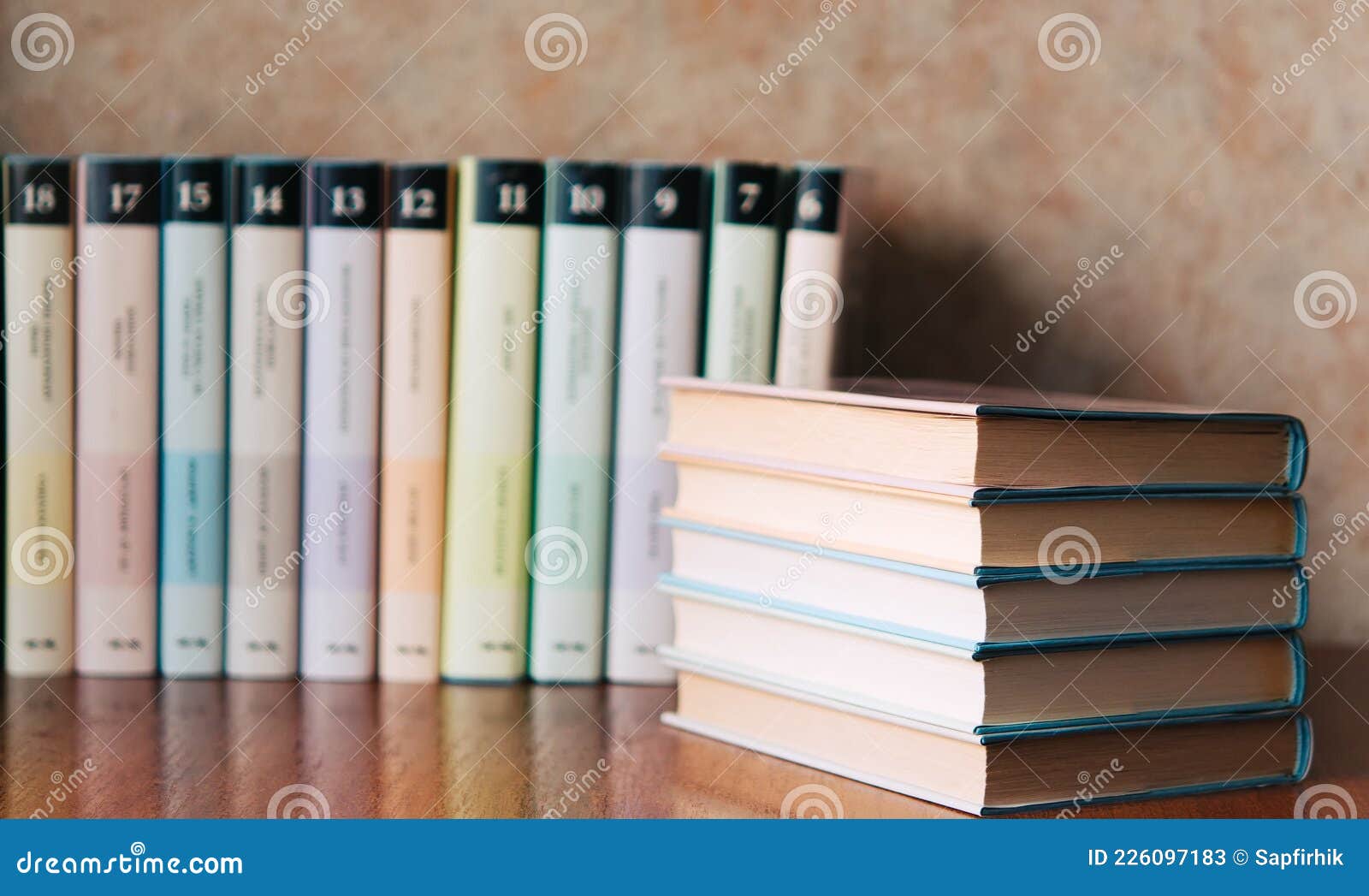 Bookshelf with Books Standing on it and a Stack of Lying Books. Stock ...