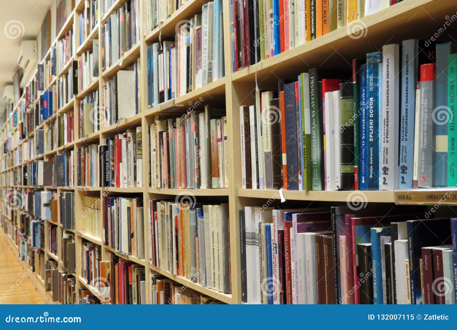 Bookshelf in library editorial image. Image of library - 132007115