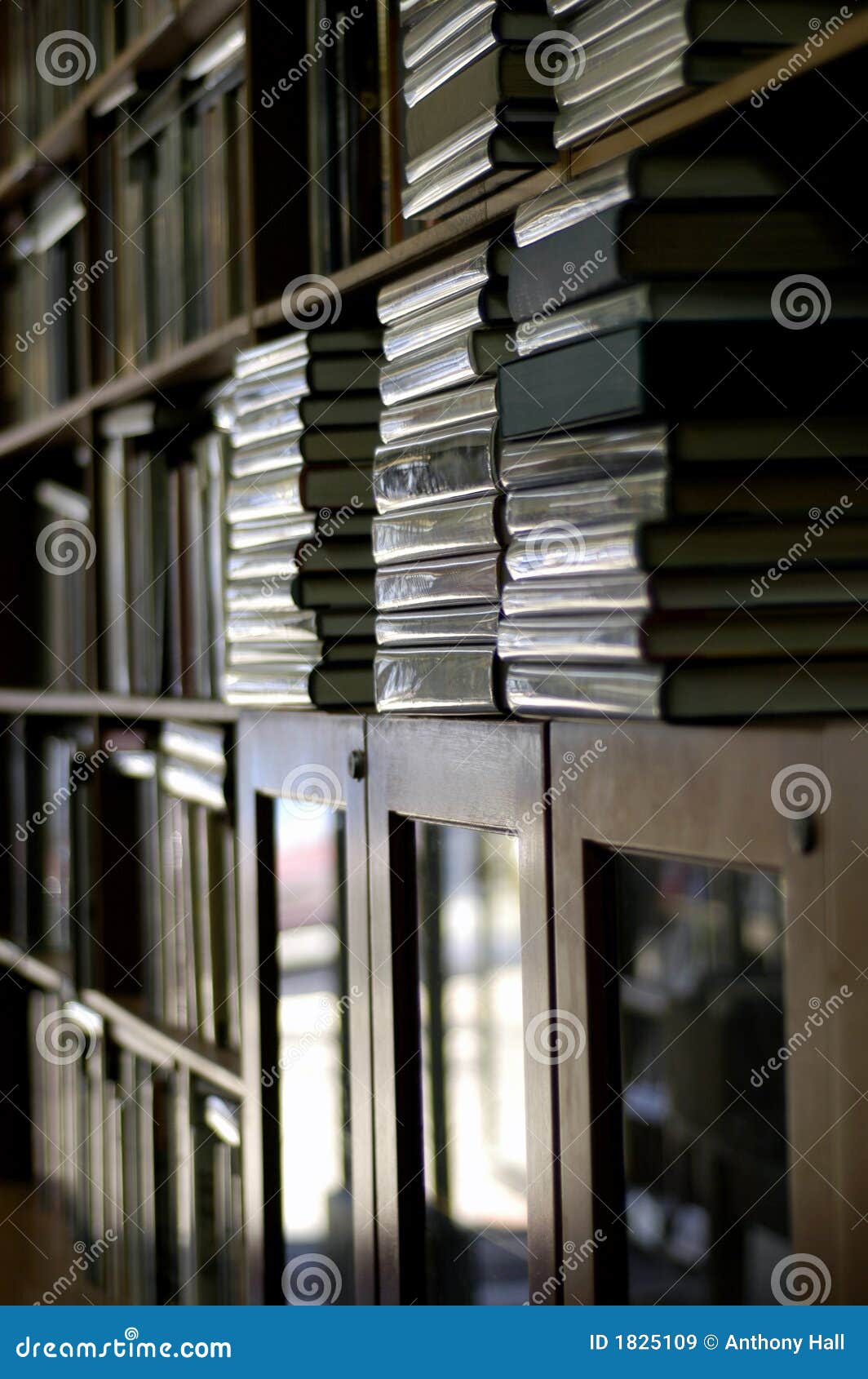 Bookshelves Piled with Books Vertical Stock Image - Image of bookstore ...