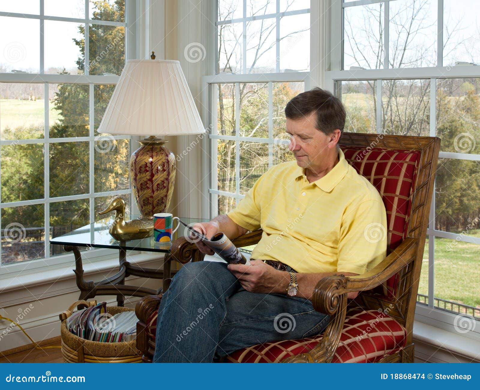 Boomer Reading a Magazine by Garden Stock Photo - Image of relax ...