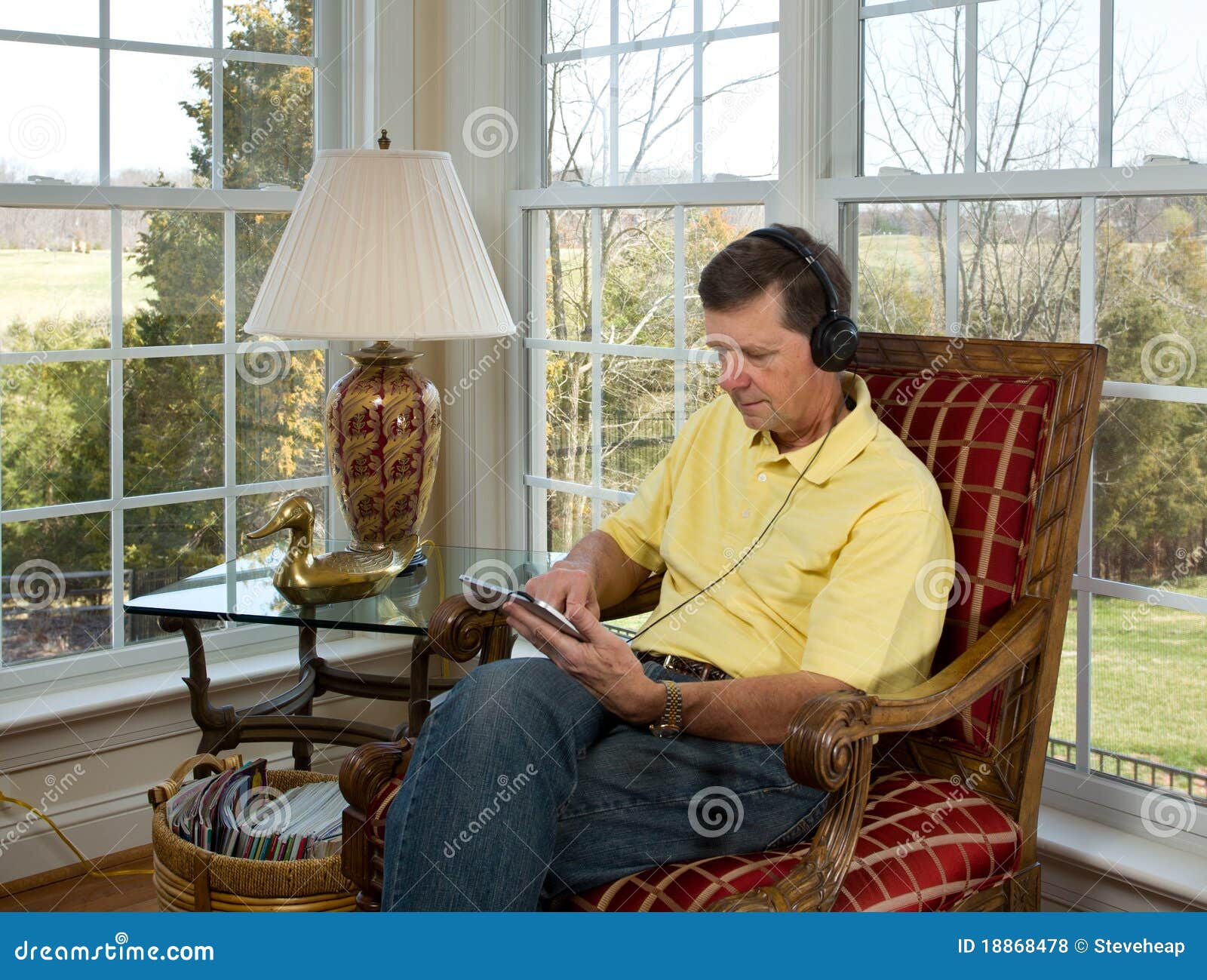 Boomer Reading on Tablet Computer Stock Photo - Image of person ...