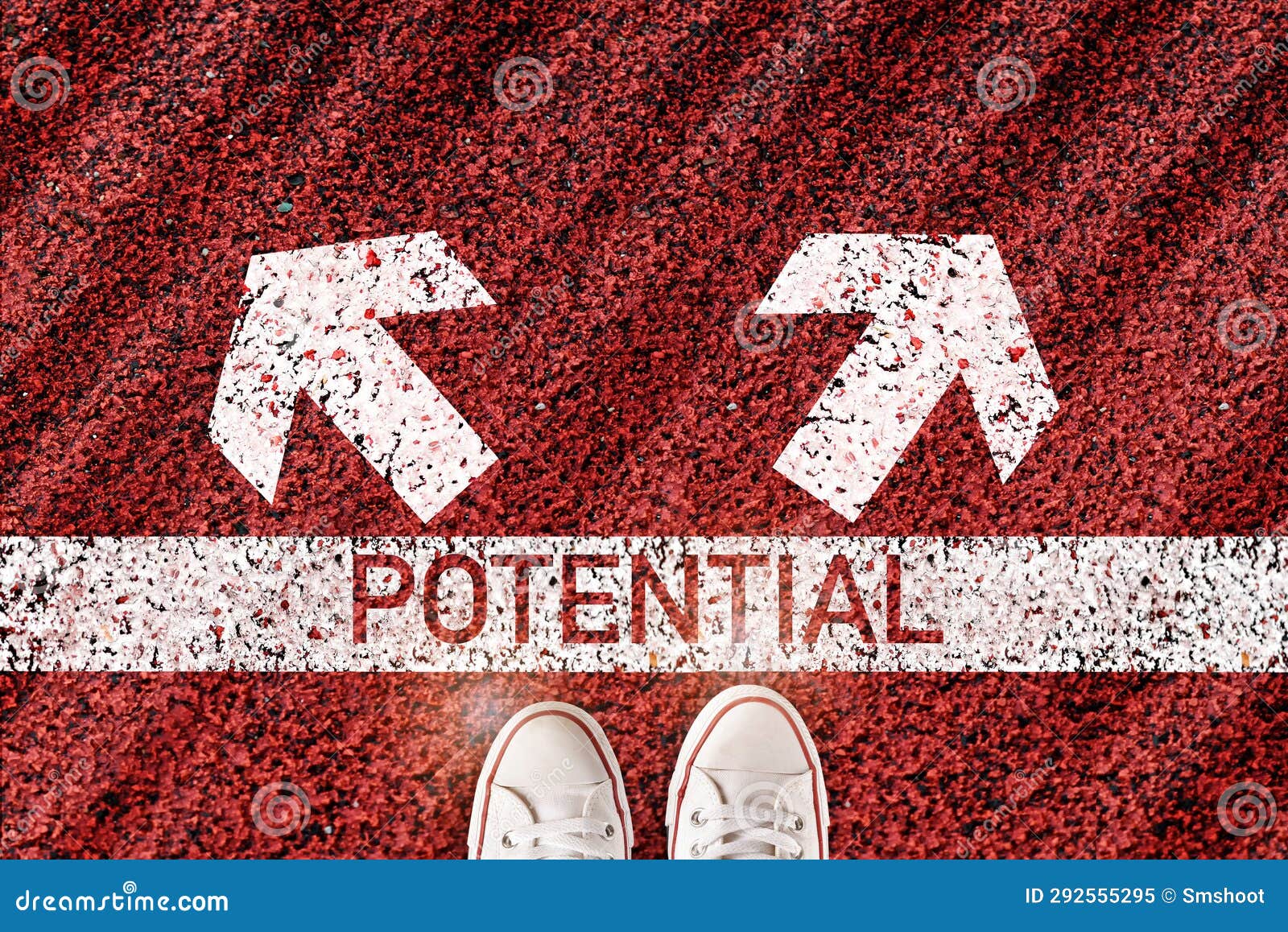 Potential Written on White Line with White Arrow on Red Road Stock ...