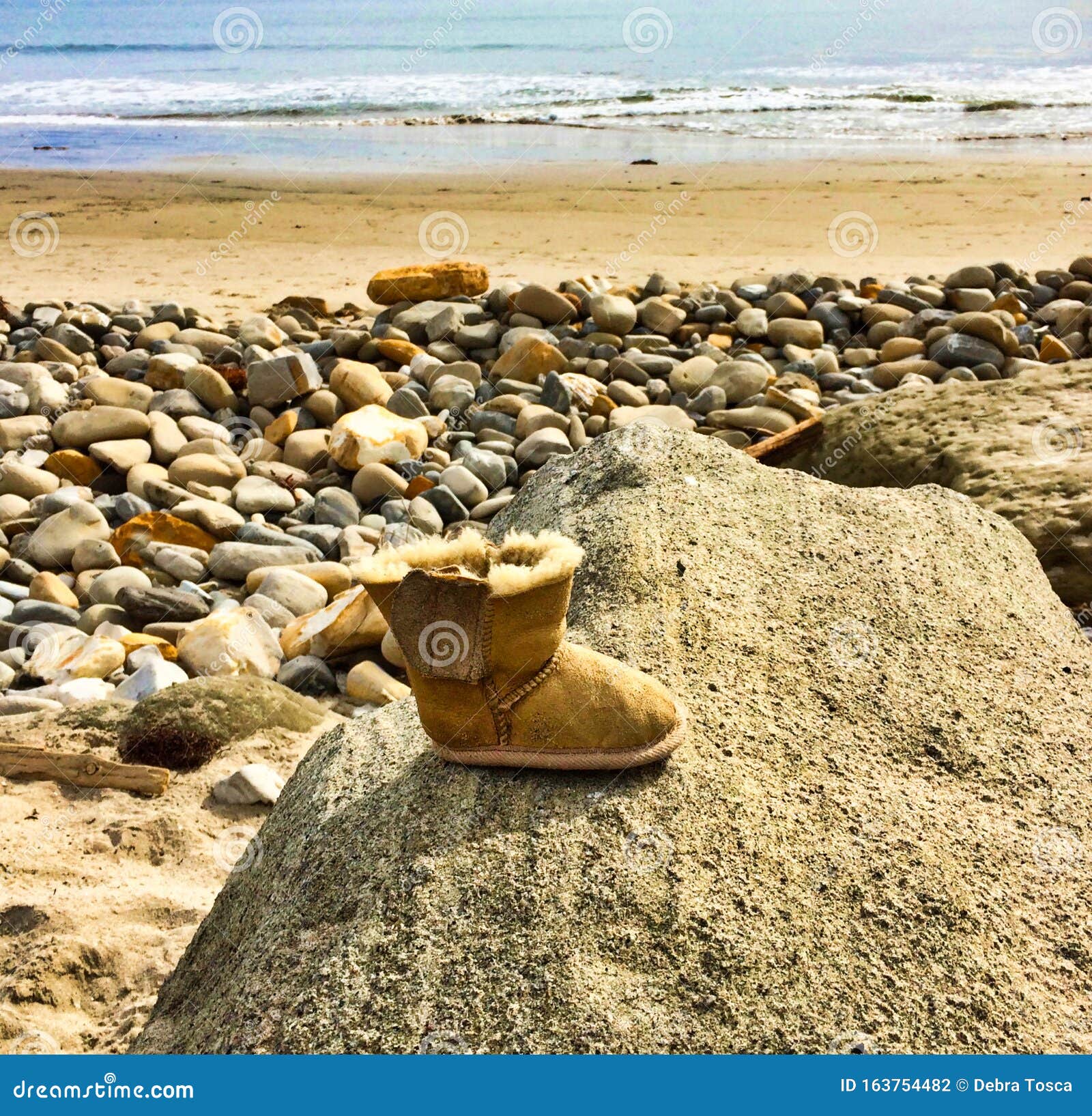 Boot rock ocean stock photo. Image of left, rock, ocean - 163754482