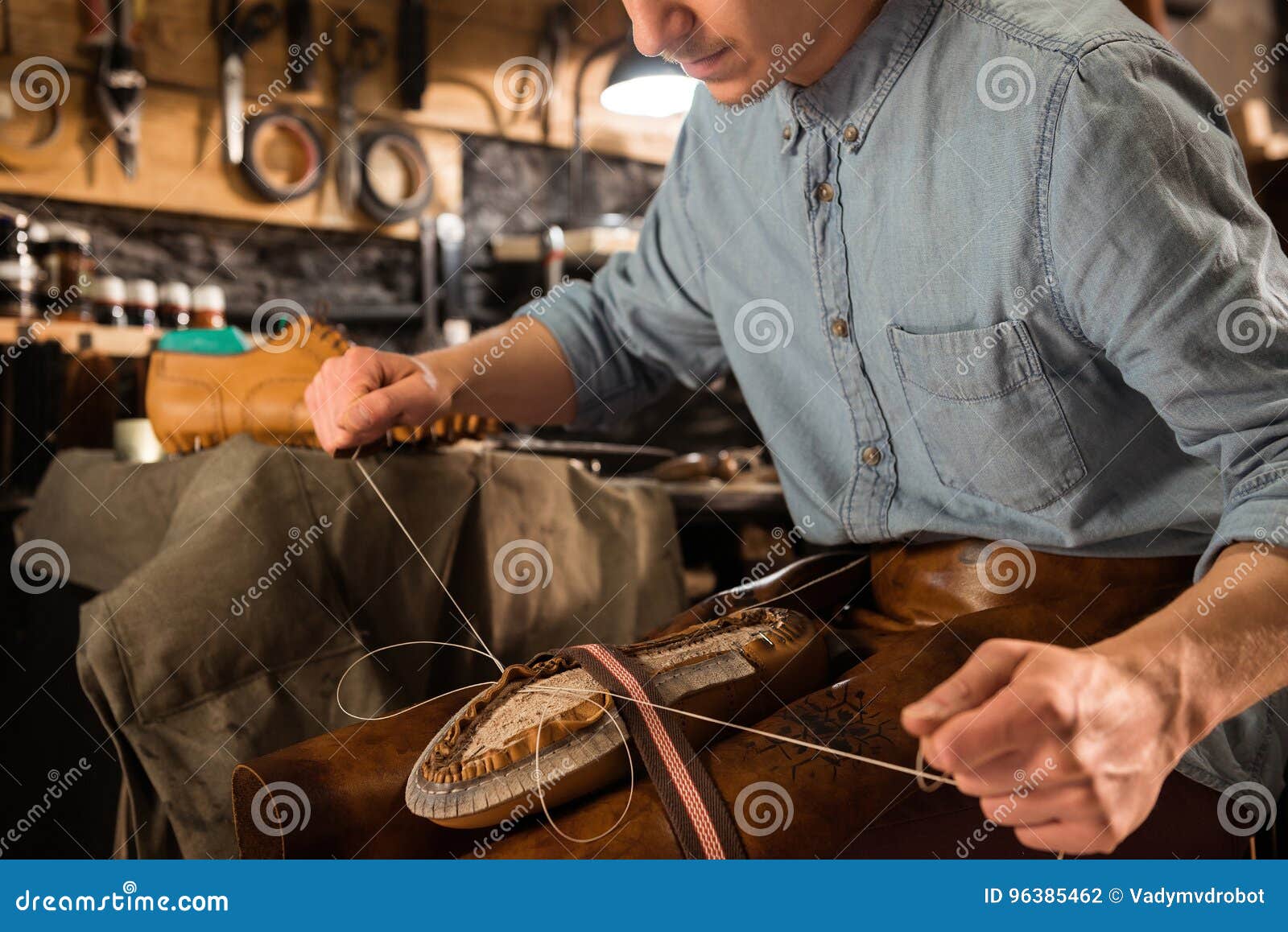 Bootmaker Sitting in Workshop Making Shoes Stock Photo - Image of ...