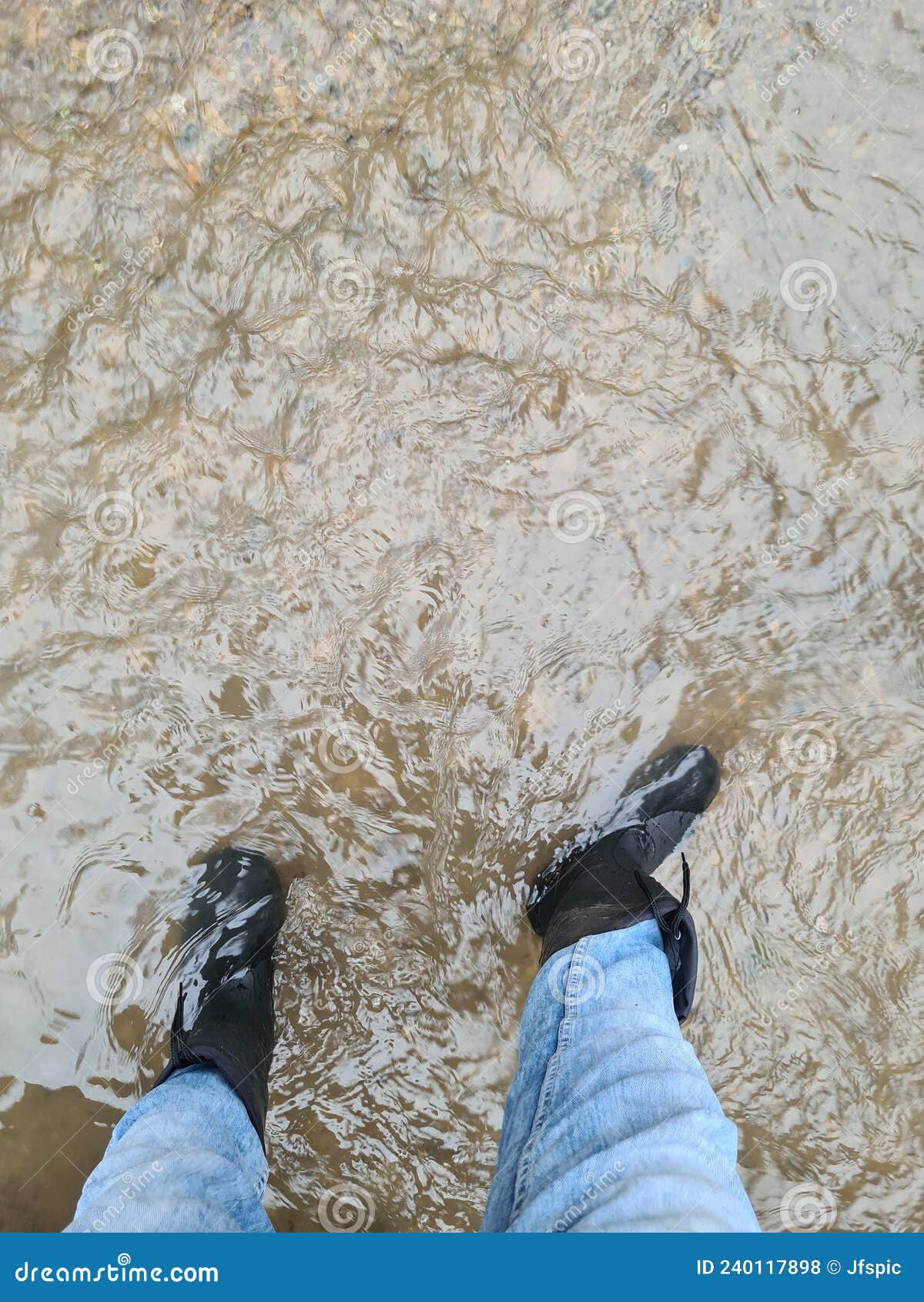 Boots in the flood stock photo. Image of closeup, melt - 240117898