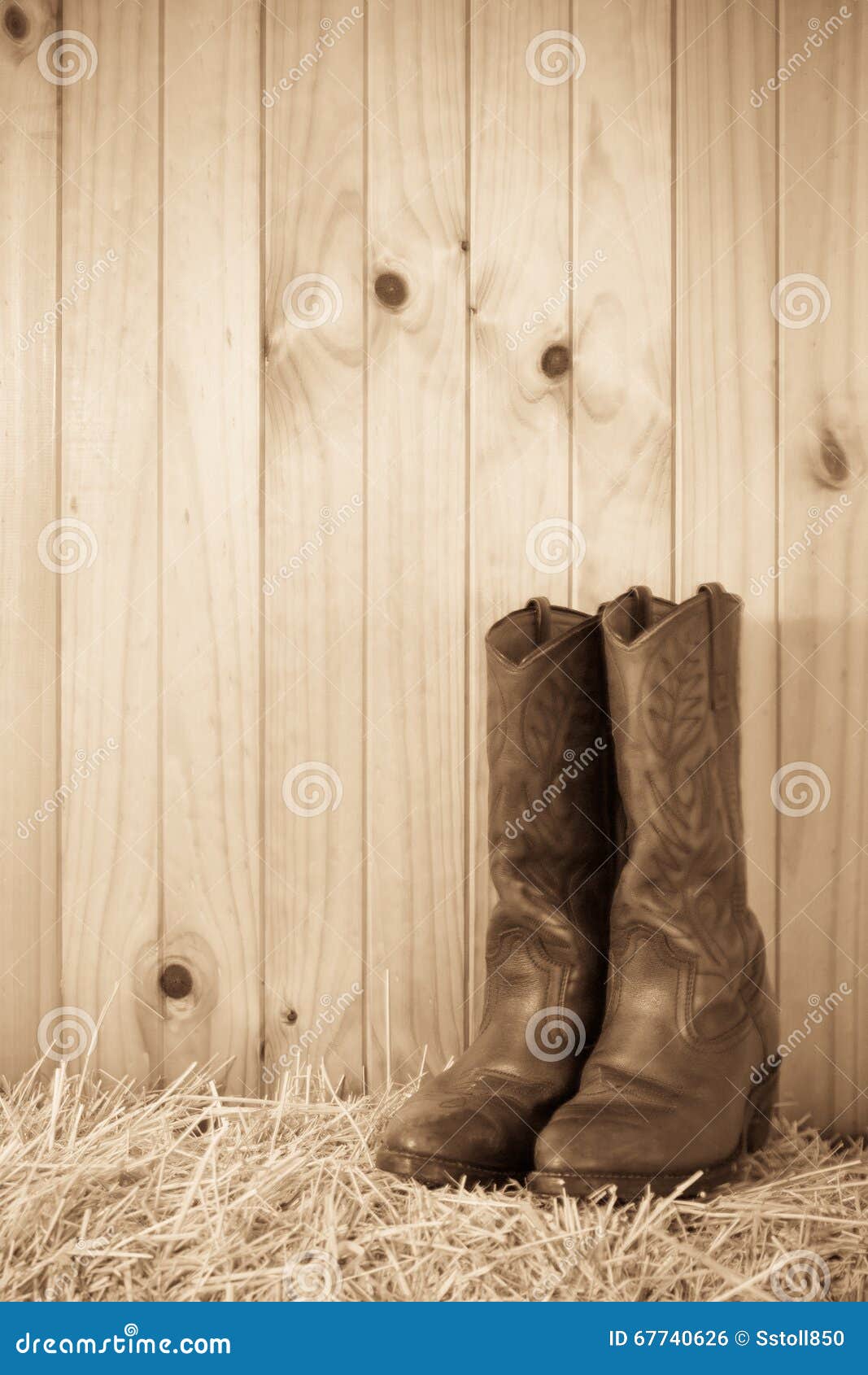 Boots on hay bale stock photo. Image of western, rural - 67740626