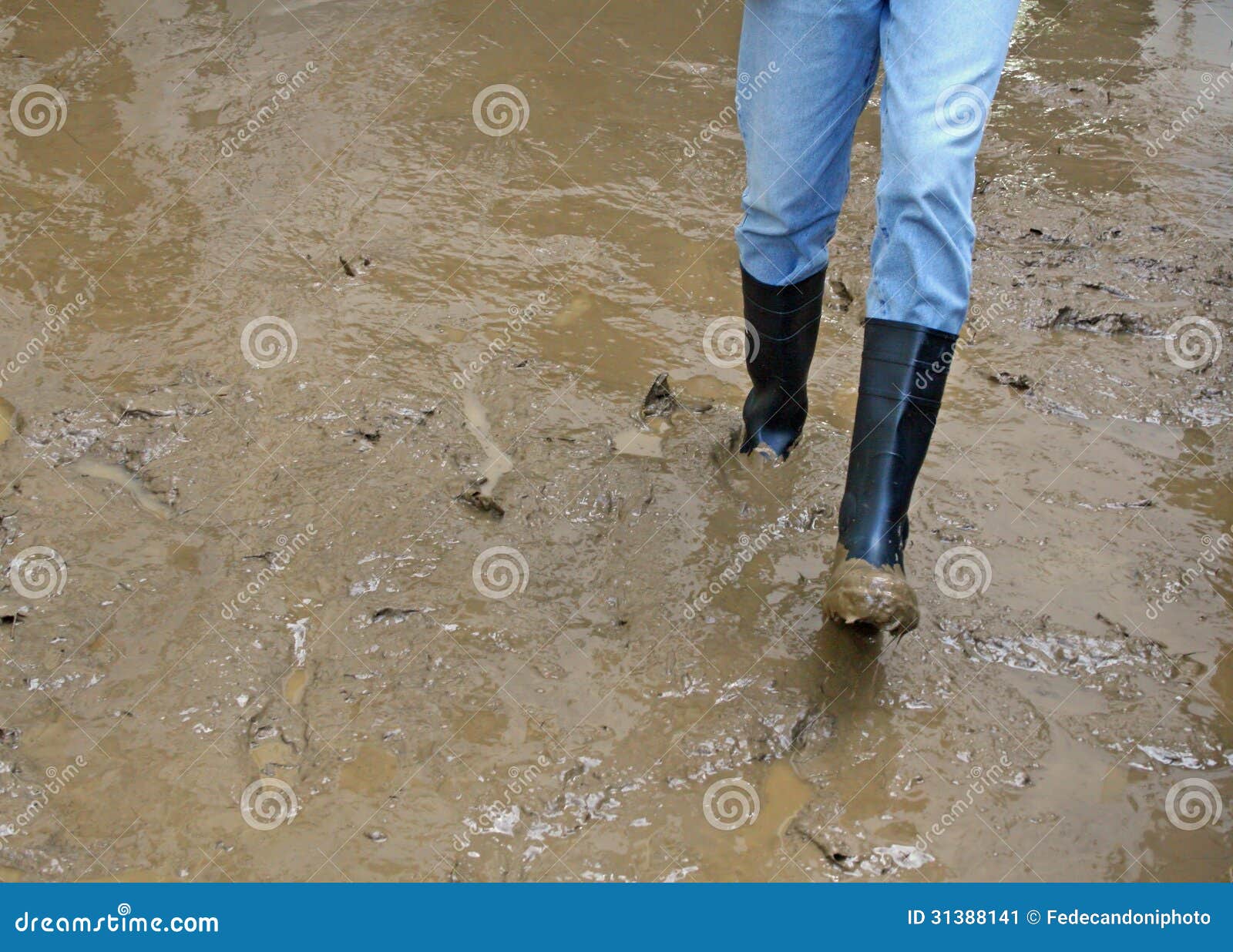 Boots in the Mud of the Flood after Natural Disaster Stock Image ...