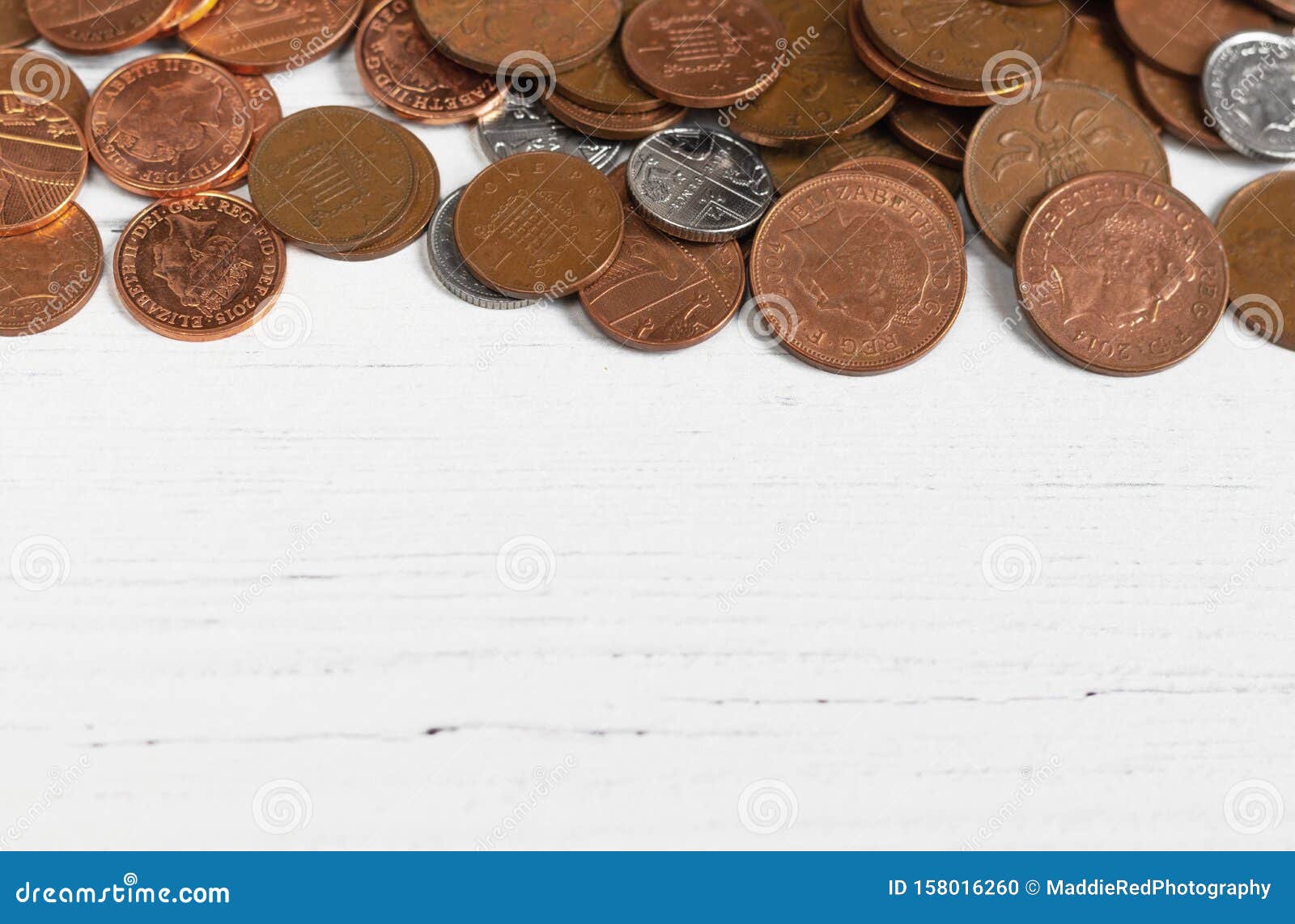Border of Coins on a White Table, Money Savings Concept with Copy Space ...