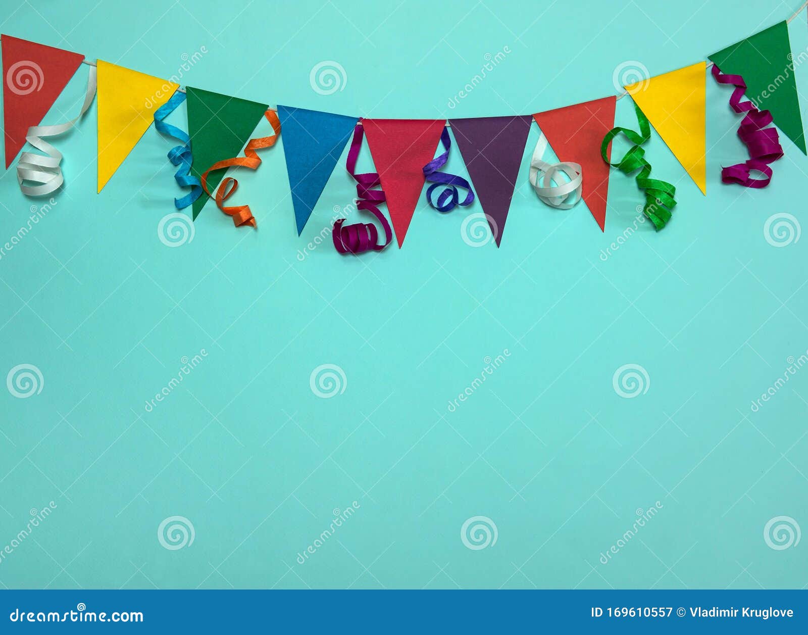 Border of Triangular Colored Paper Flags and Streamers on a Light Blue ...
