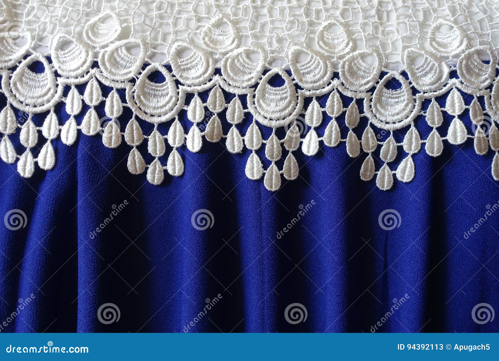 Border of White Lace Over Draped Blue Fabric Stock Image - Image of ...