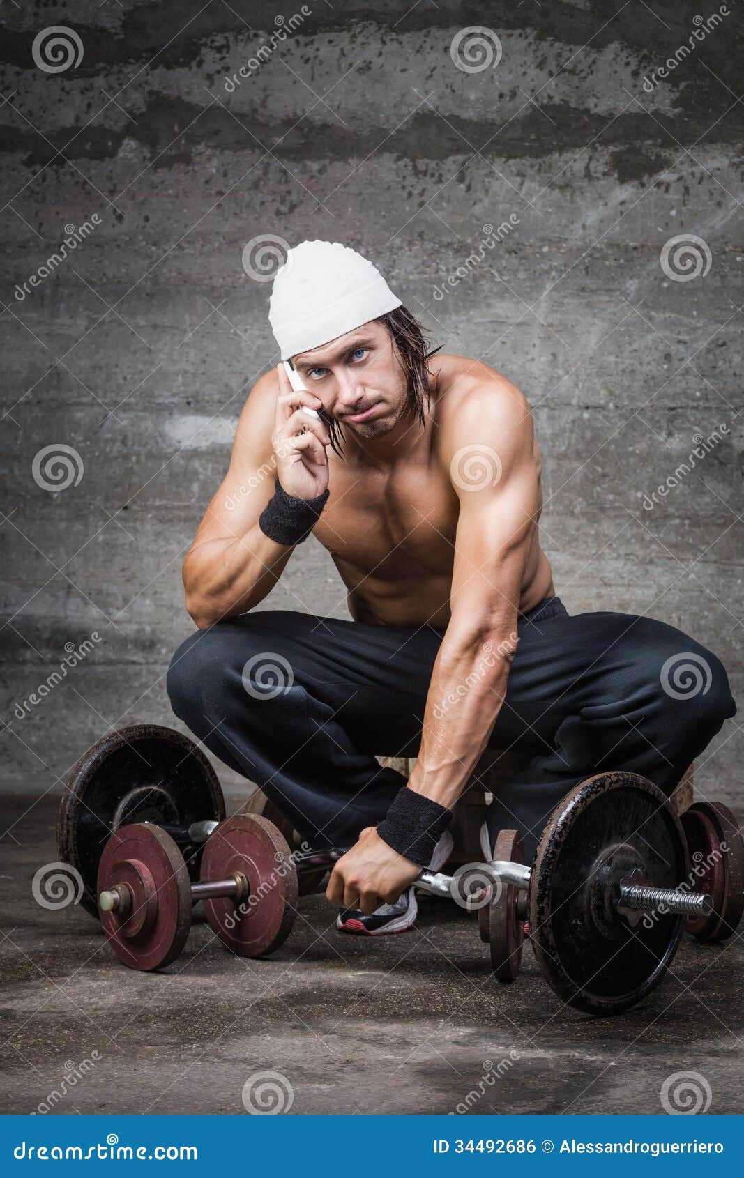 Bored Bodybuilder Talking on the Phone Stock Photo - Image of dumbbell ...