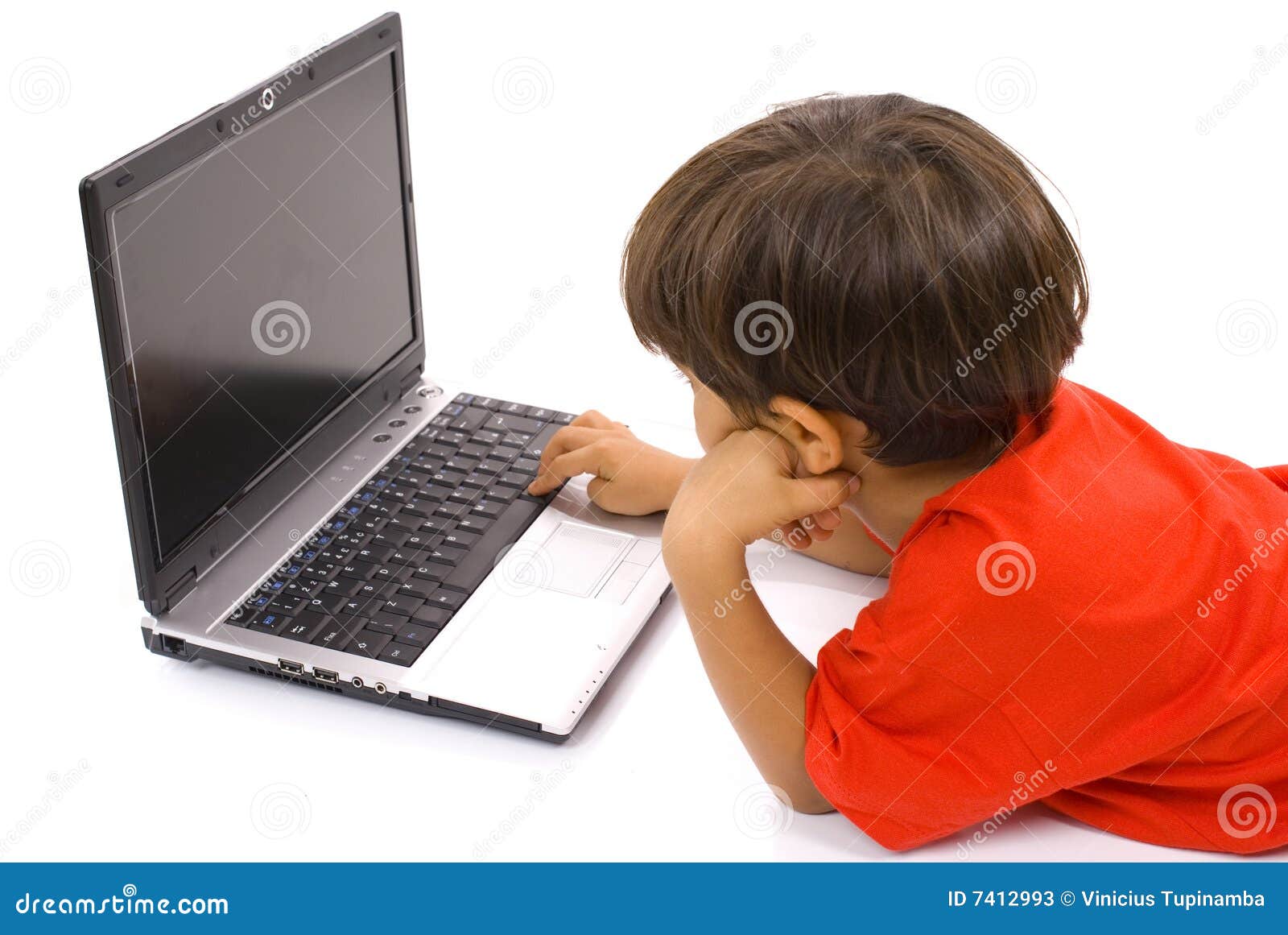 Bored Boy using Laptop stock image. Image of network, shirt - 7412993