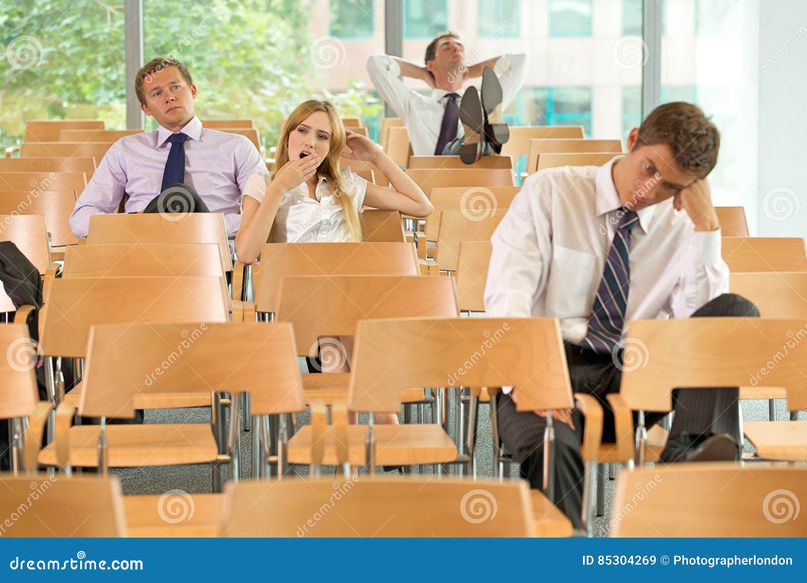 Bored Business Executives Sitting in Conference Room Stock Image ...