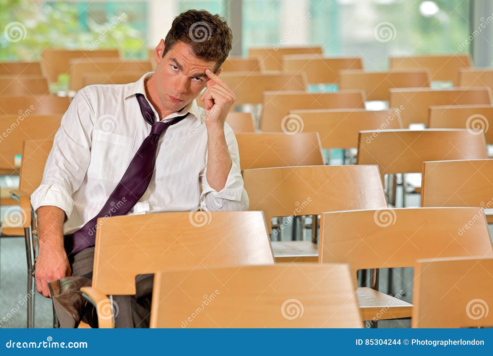 Bored Businessman Sitting at Conference Room Stock Photo - Image of ...