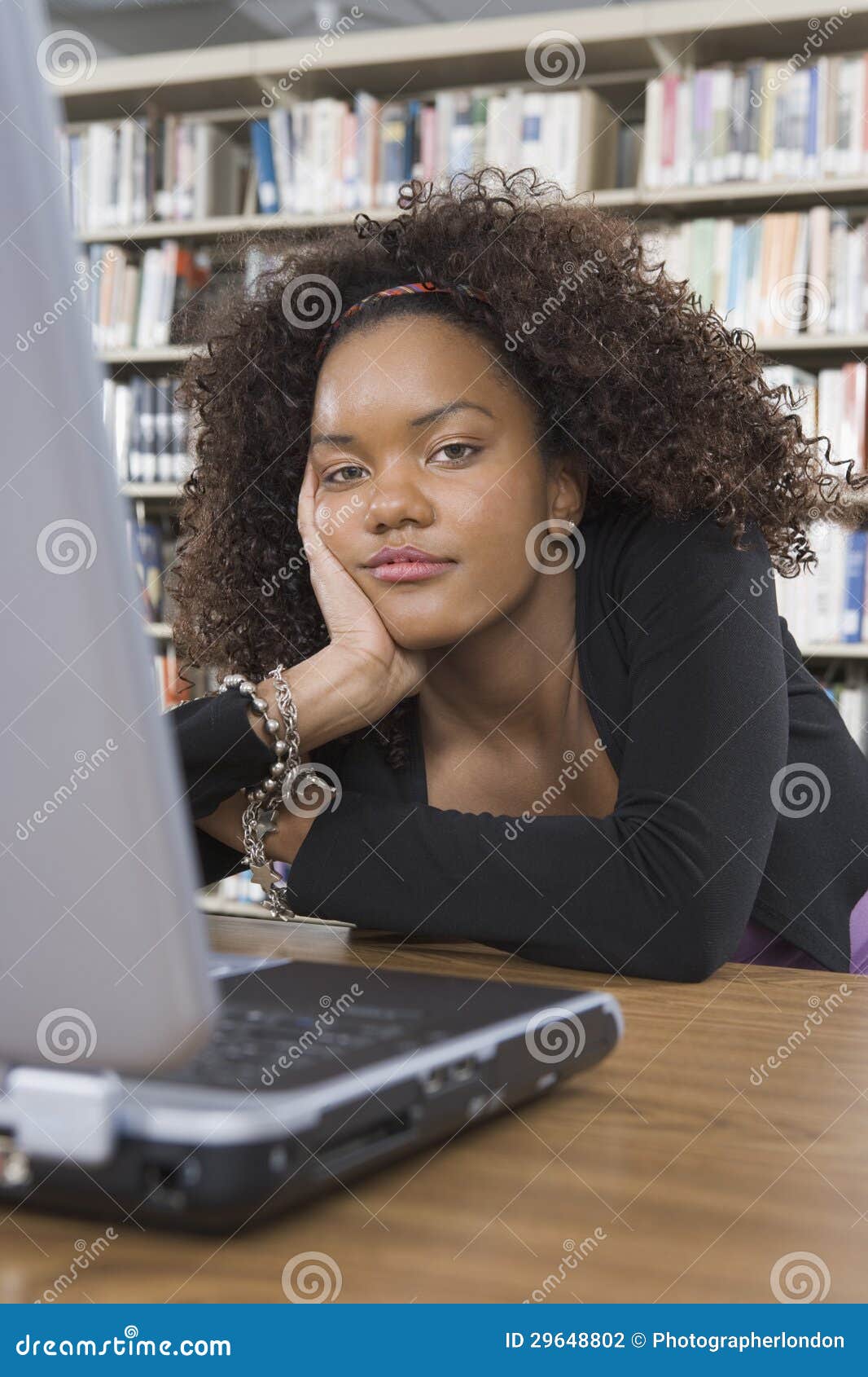 Bored Female Student Sitting at Library Desk Stock Photo - Image of ...