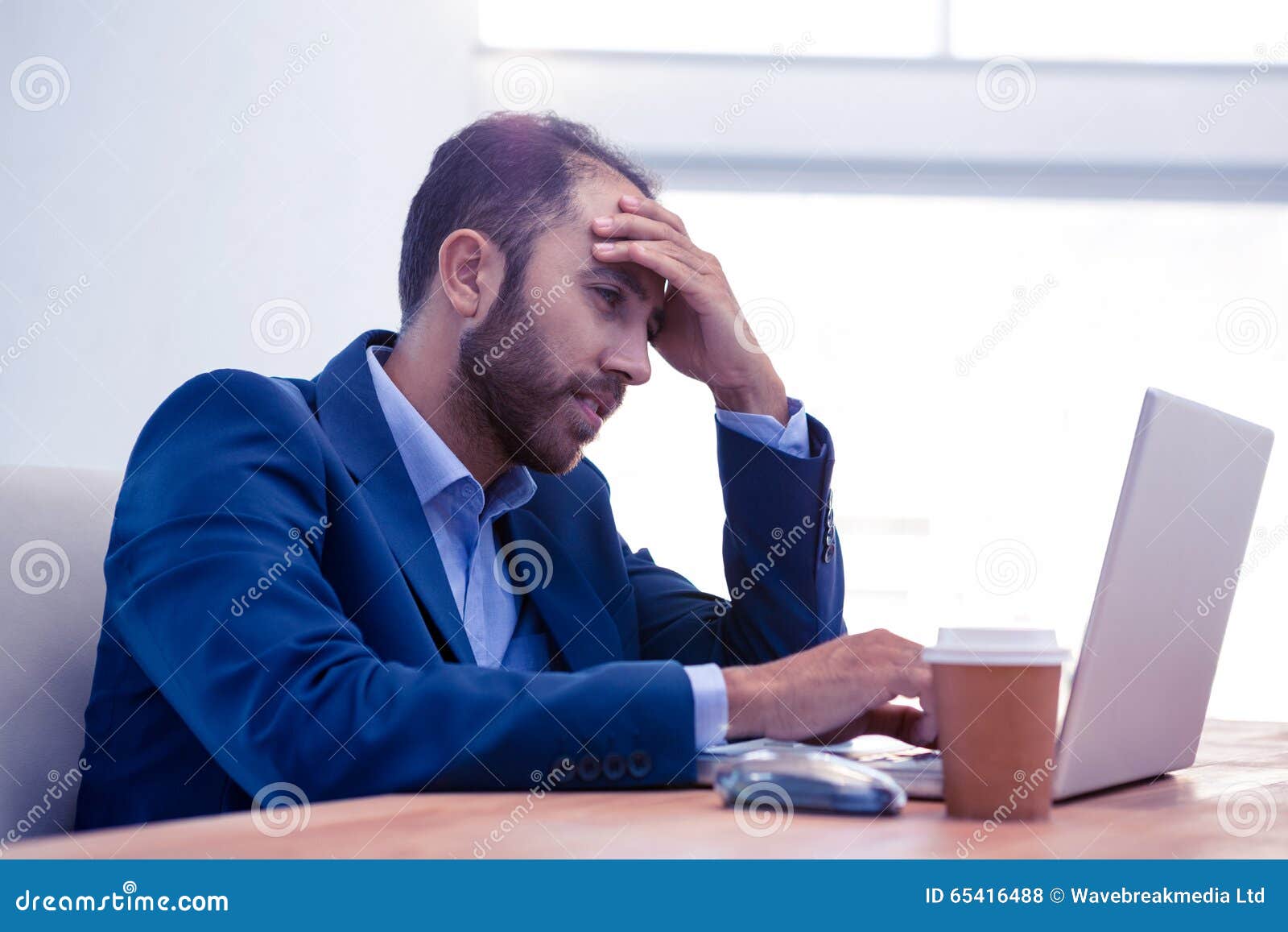 Bored Man Working on Laptop in Office Stock Photo - Image of laptop ...