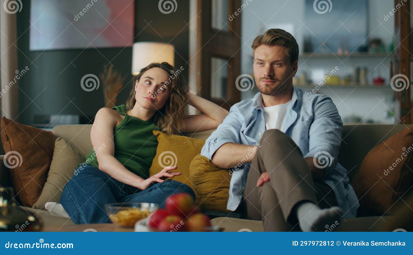 Bored Spouses Watching Movie Feeling Disinterested at Home. Man Woman ... Bored Spouses Watching Movie Feeling Disinterested at Home. Man Woman ...