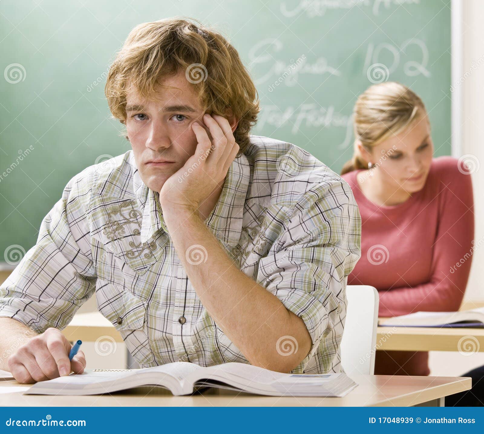 Bored Student at Desk in Classroom Stock Image - Image of western ...