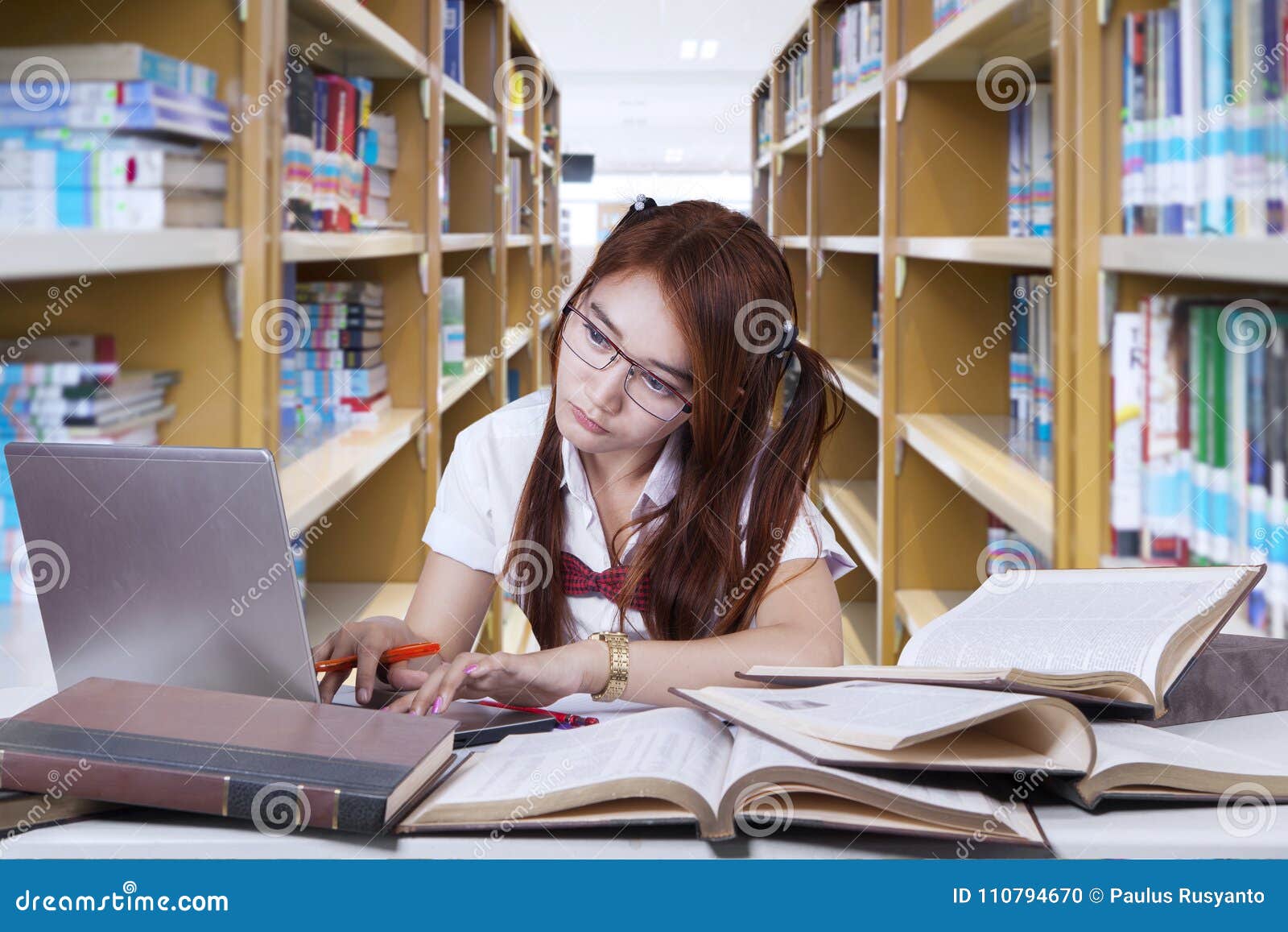 Bored Student Doing Homework in Library Stock Photo - Image of japanese ...