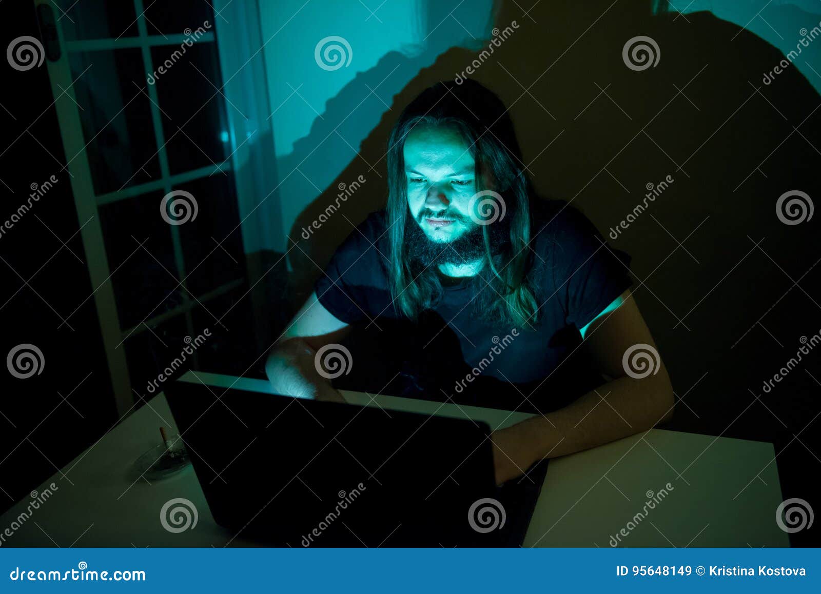 Bored User is Looking at His Computer Browsing through the Internet ...