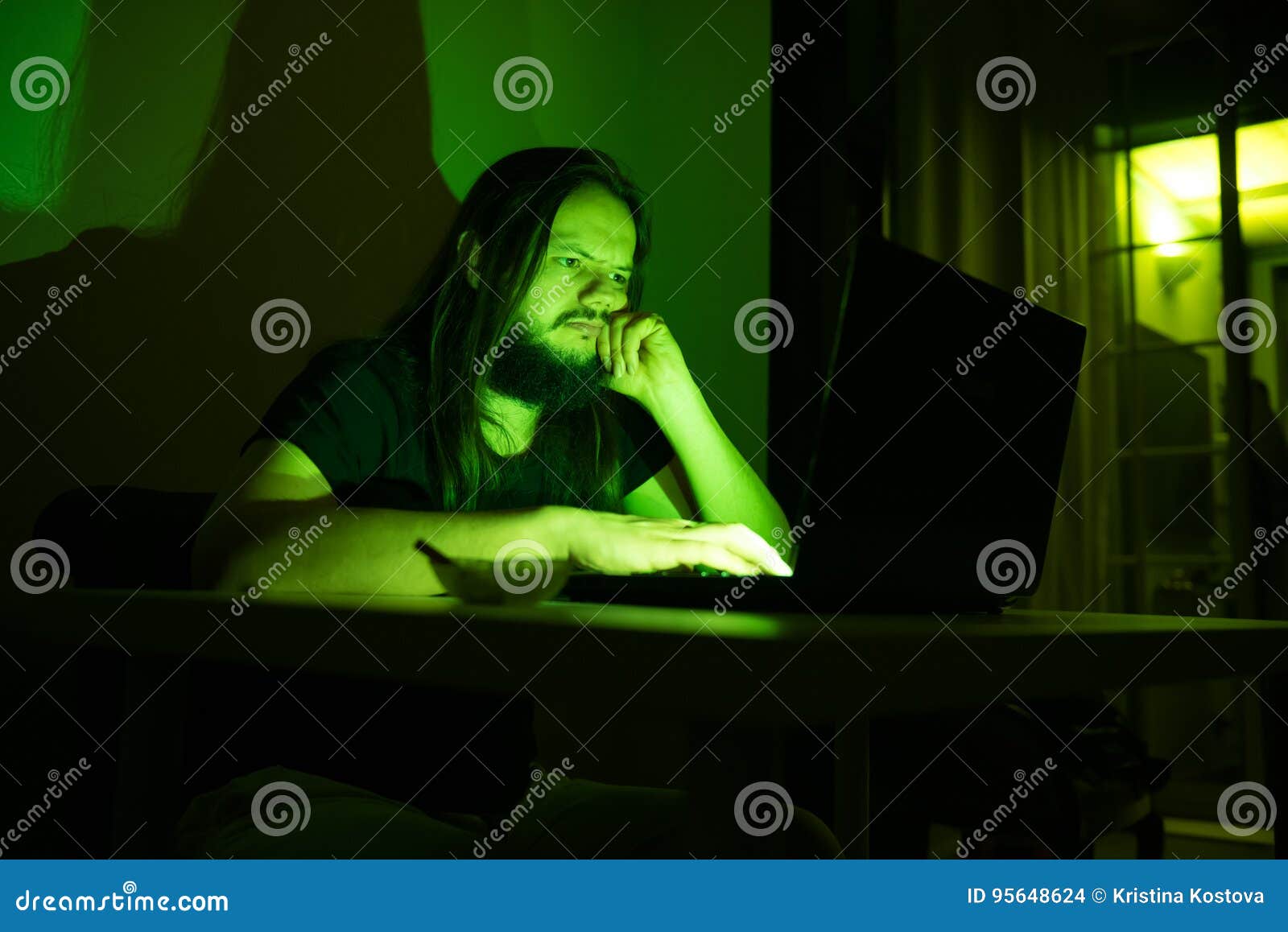 Bored User is Looking at His Computer Browsing through the Internet ...