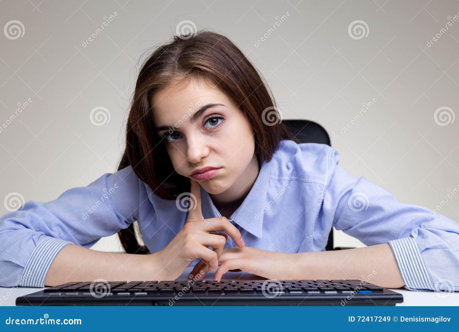 Bored woman using keyboard stock image. Image of device - 72417249