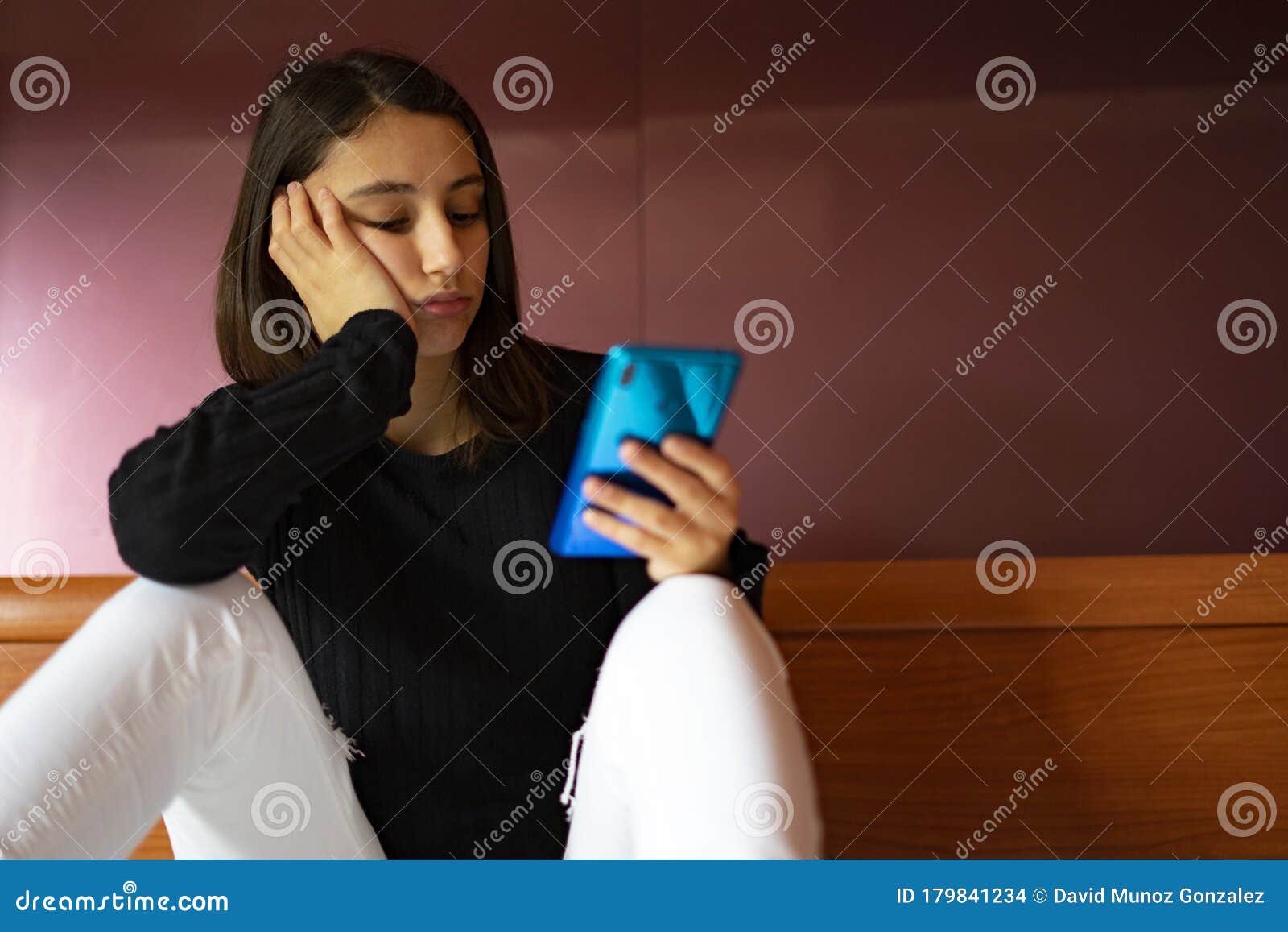 Bored Woman Using the Mobile Phone at Home Stock Photo - Image of ...