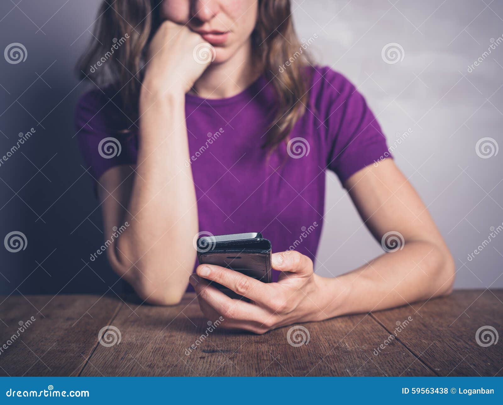 Bored Woman Using Smartphone at Table Stock Photo - Image of smartphone ...