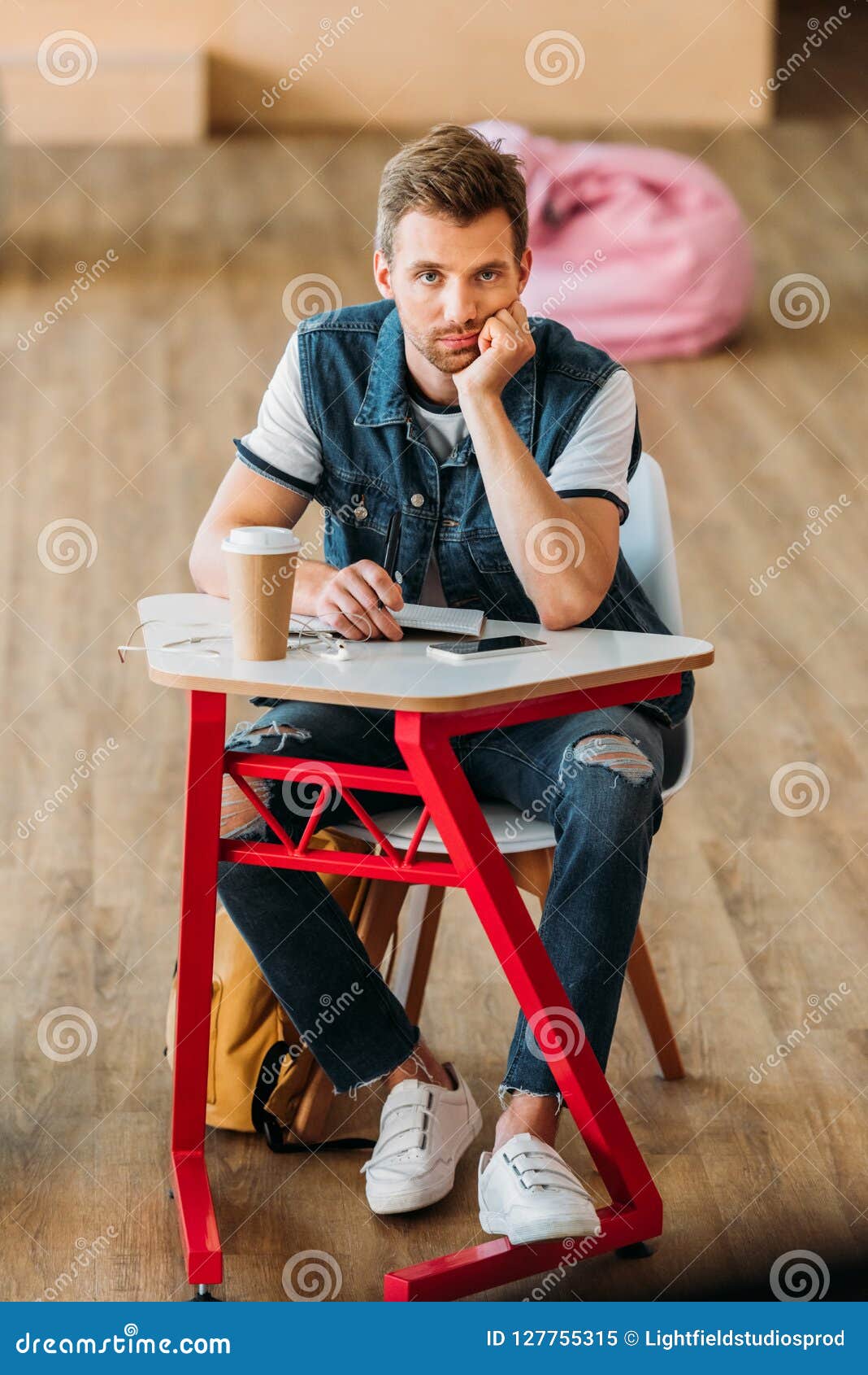 Bored Young Student Sitting at Desk during Lesson and Looking Stock ...