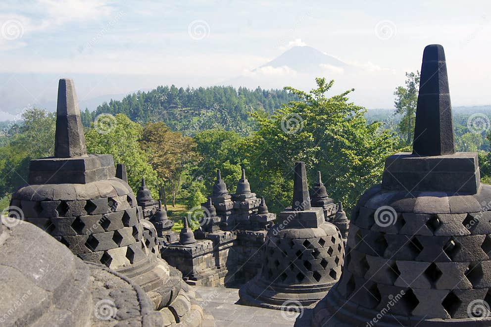 Borobudur Stupas with Active Merapi Volcano in the Background ...