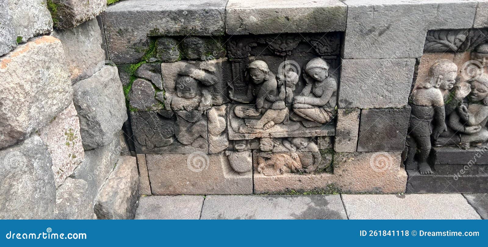 Borobudur temple reliefs stock photo. Image of families - 261841118