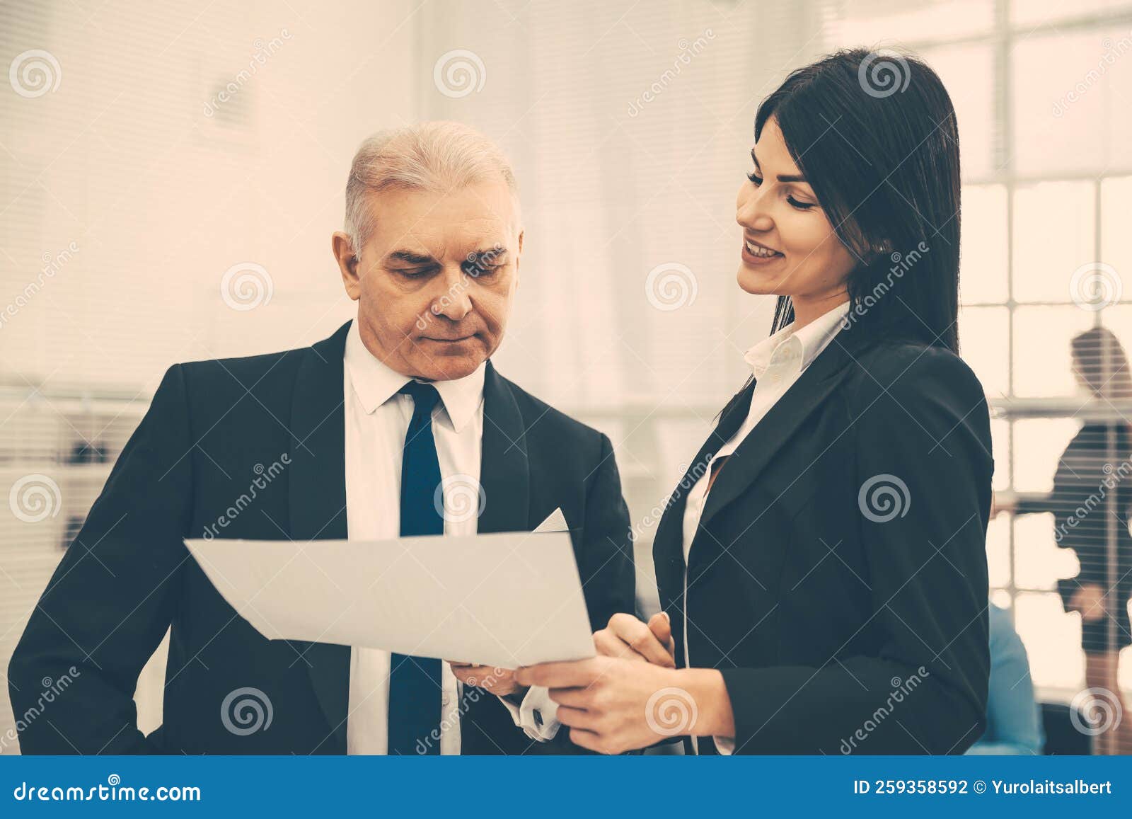 Boss and Assistant Discussing a Business Document. Stock Photo - Image ...
