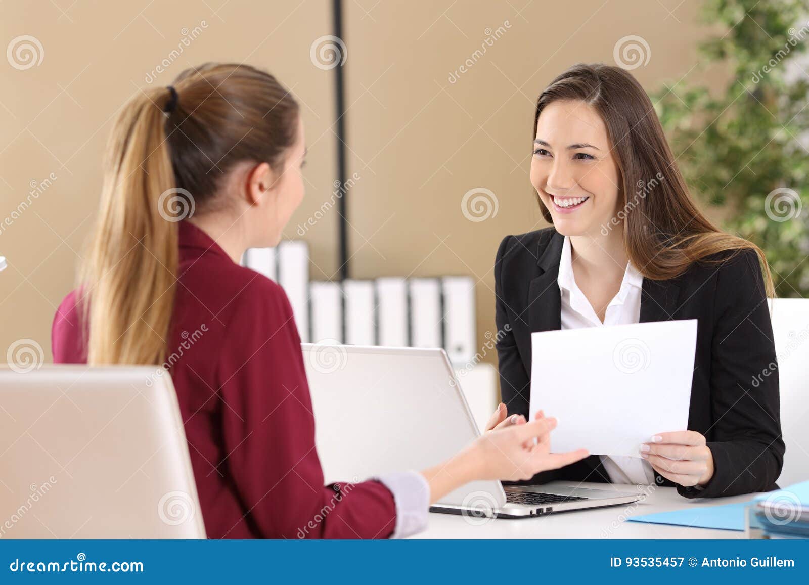 Job Interview. Young Women Review Document While Waiting For Job ...