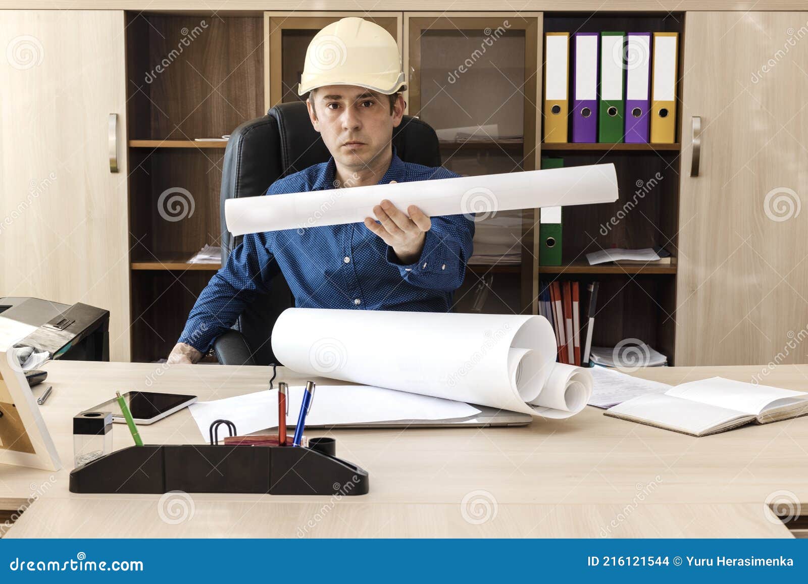 The Boss in the Construction Helmet at the Table with the Project ...