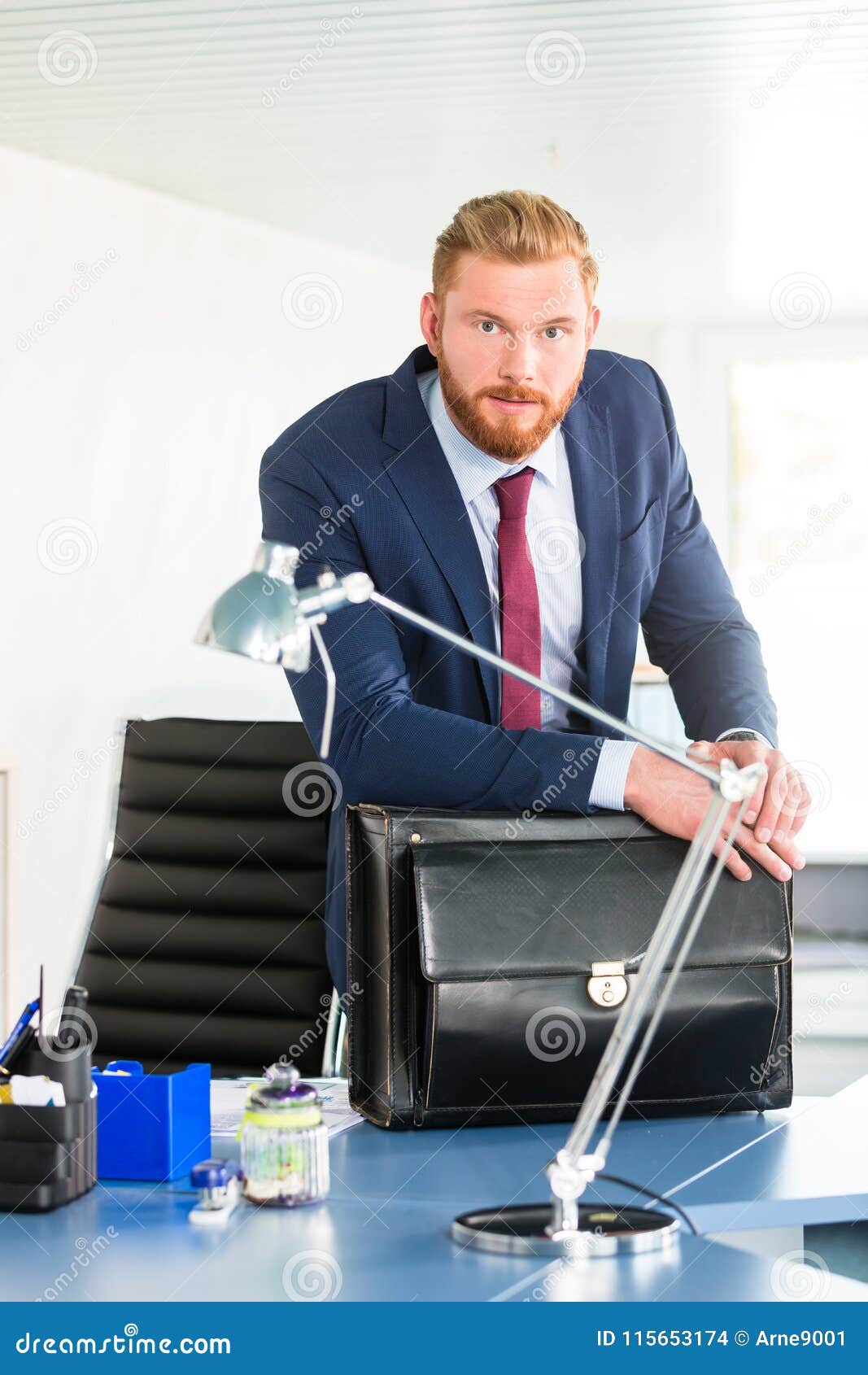 Boss at Desk Leaning Over Briefcase Stock Photo - Image of financial ...