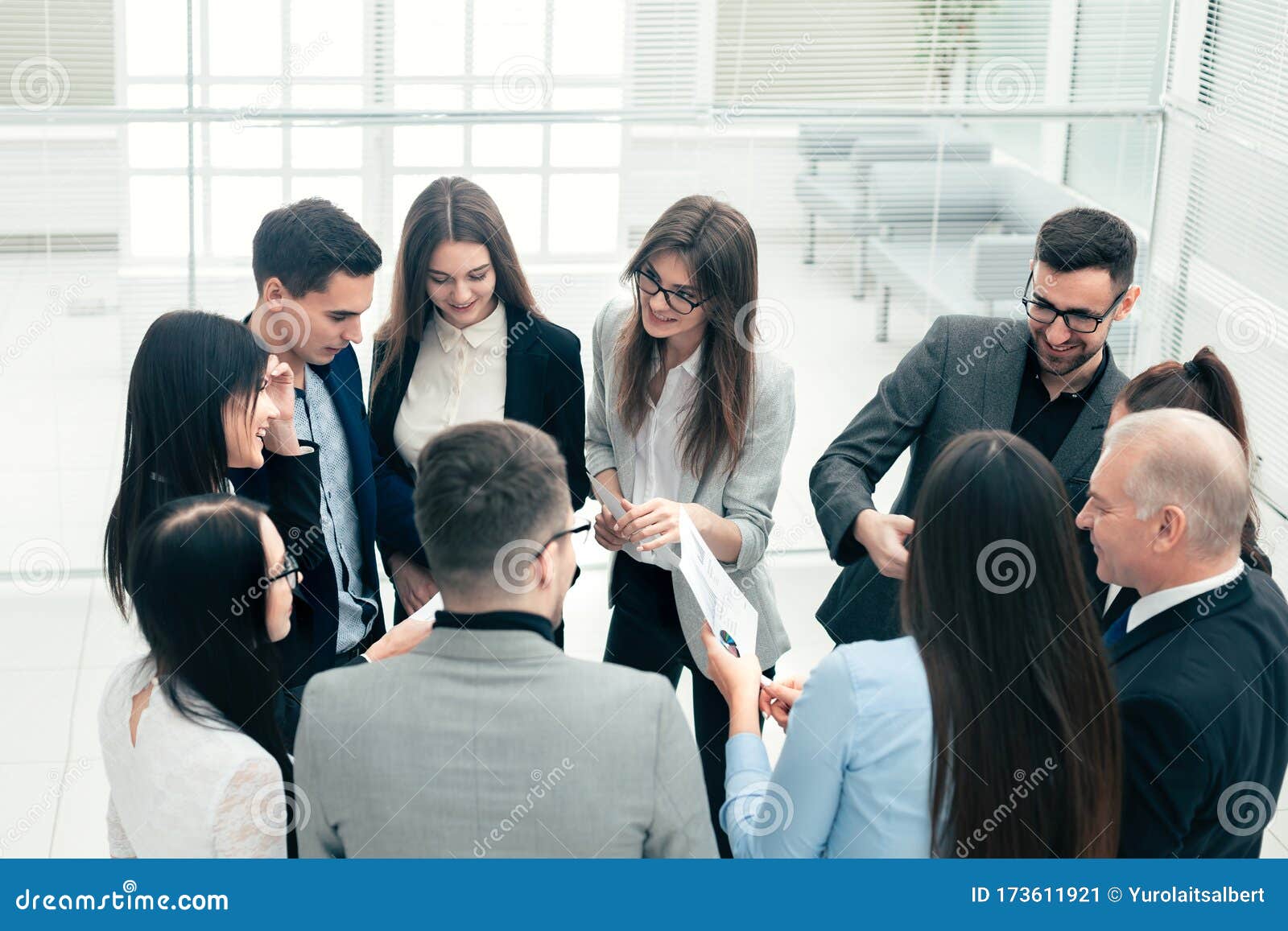 Boss and a Group of Employees Discussing Business Documents. Stock ...