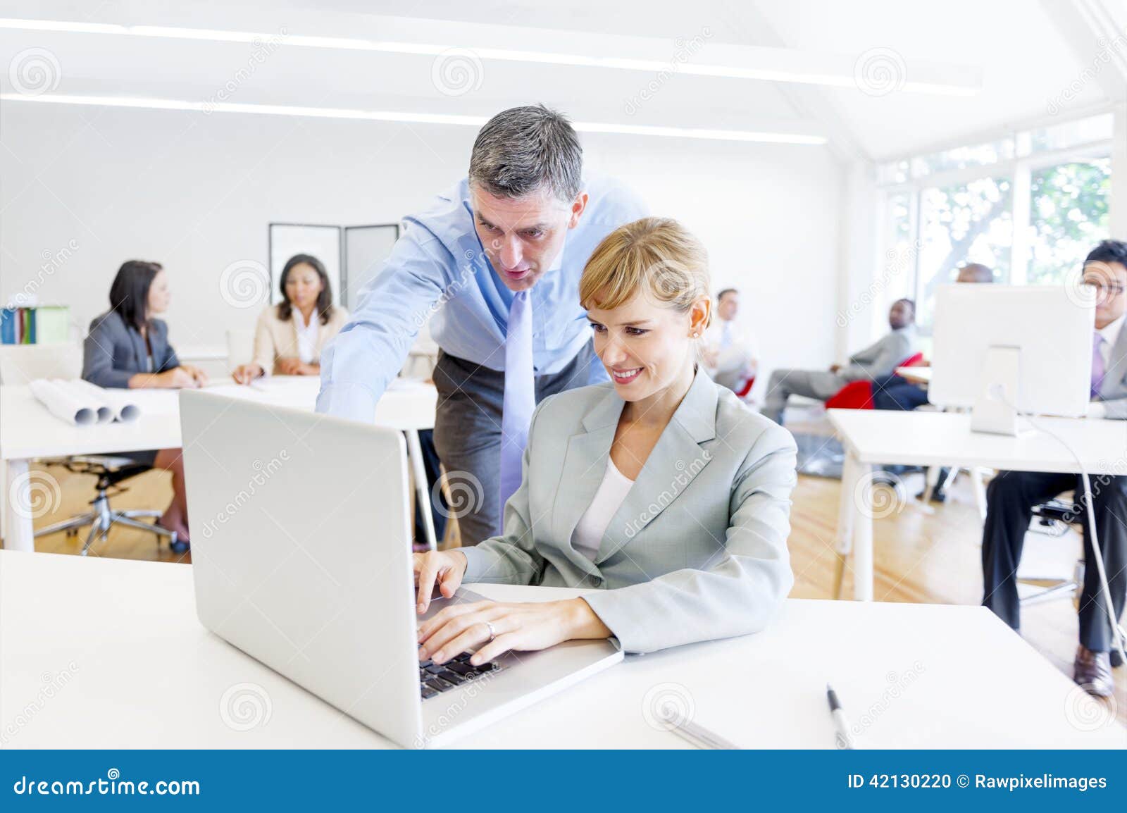 A Boss Guiding His Employee with Her Job Stock Photo - Image of ...